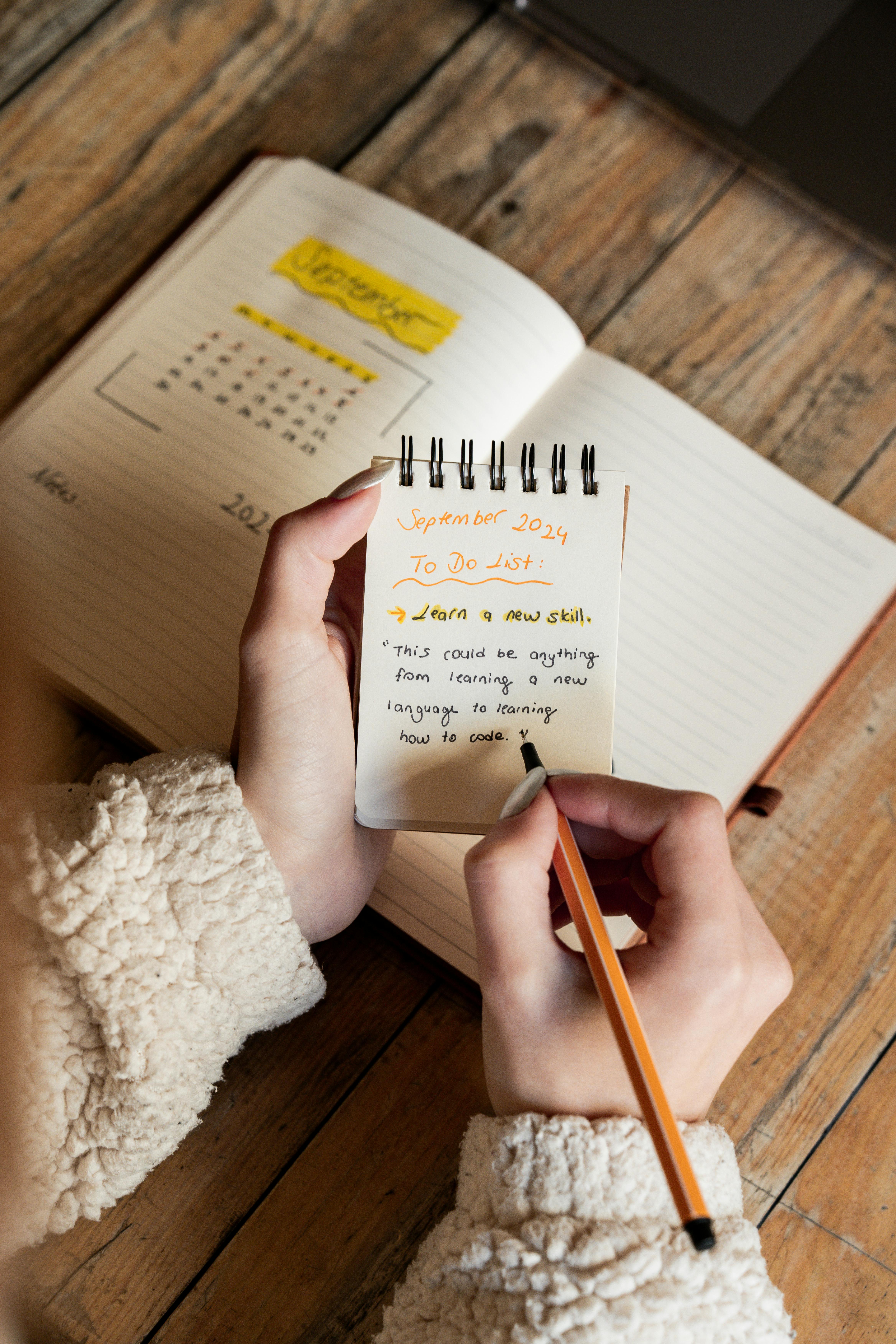 Planning September in Notepad · Free Stock Photo