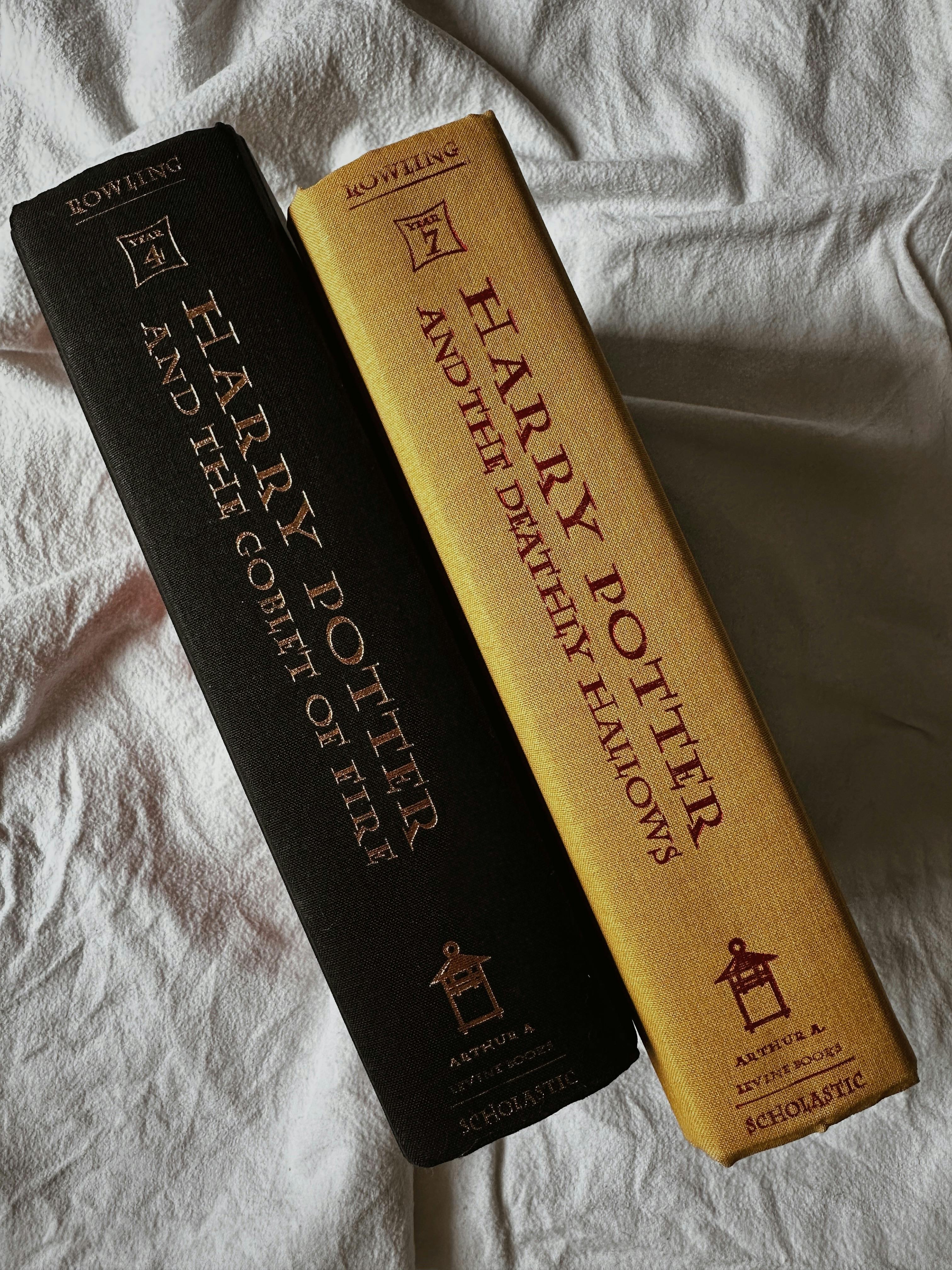 Harry Potter Book and Black Headphones With Trinket · Free Stock Photo