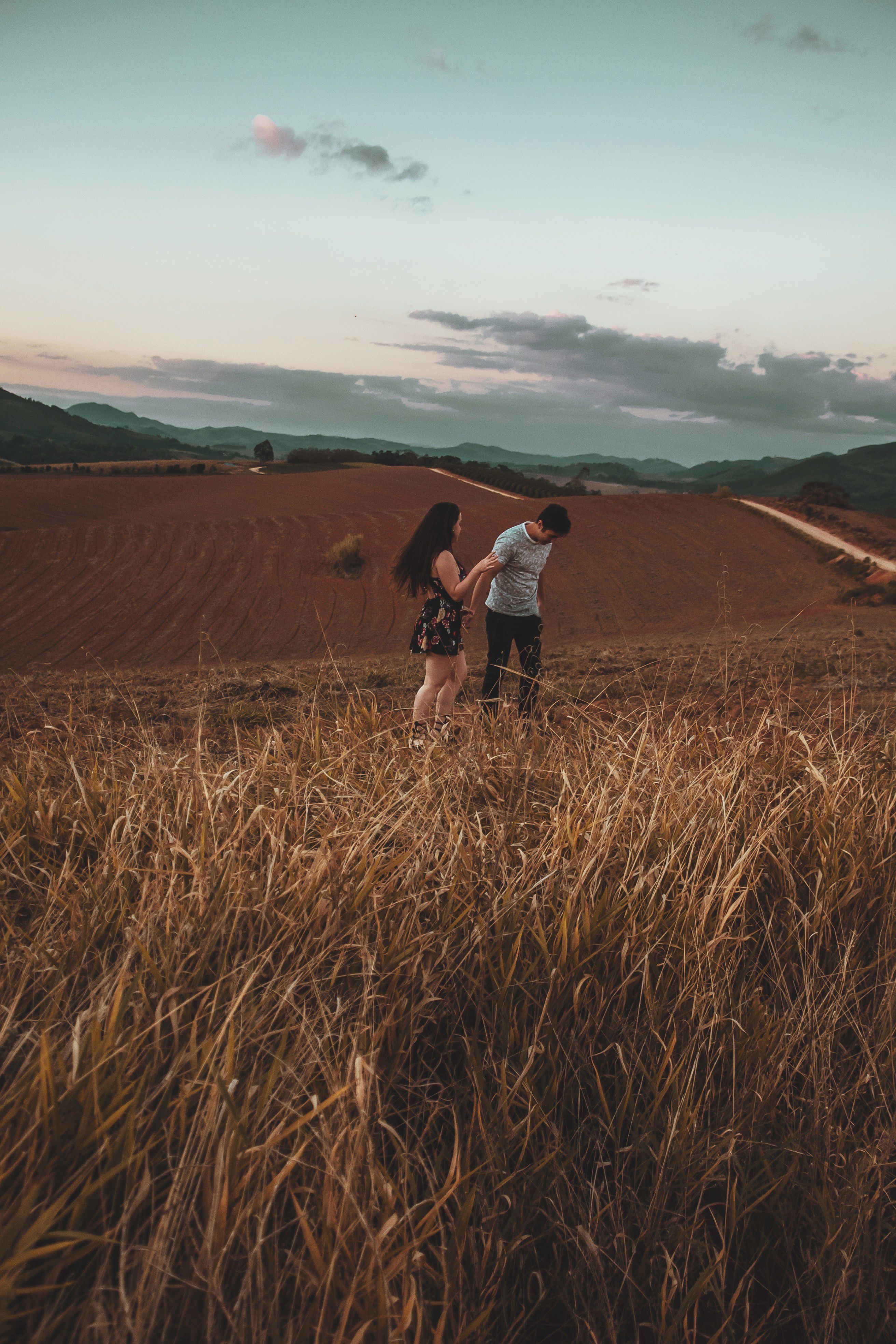 Two Person Walking On Path Under Blue Sky · Free Stock Photo
