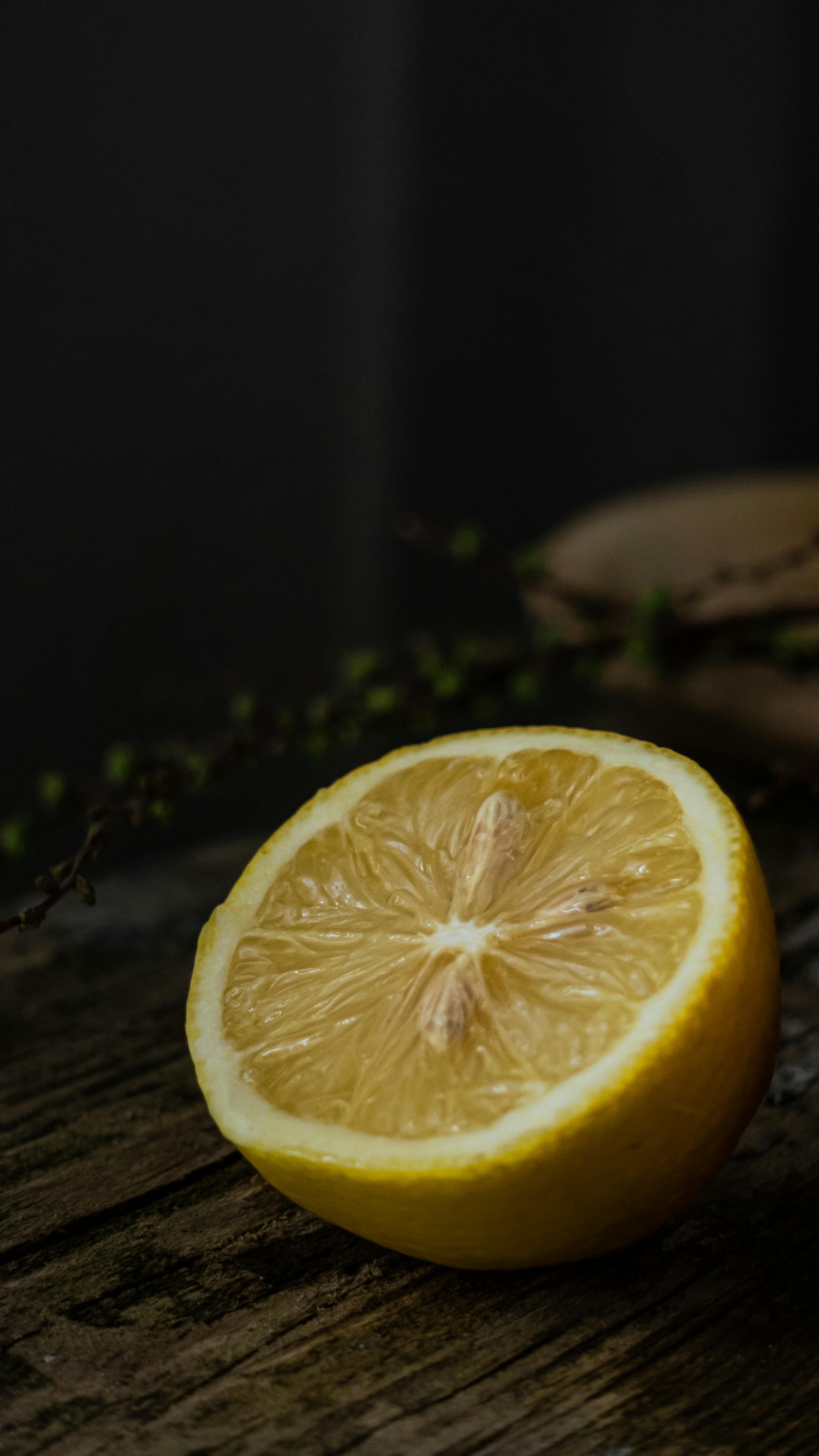 Close-up Photo of Sliced Yellow Lemon on White Surface · Free Stock Photo