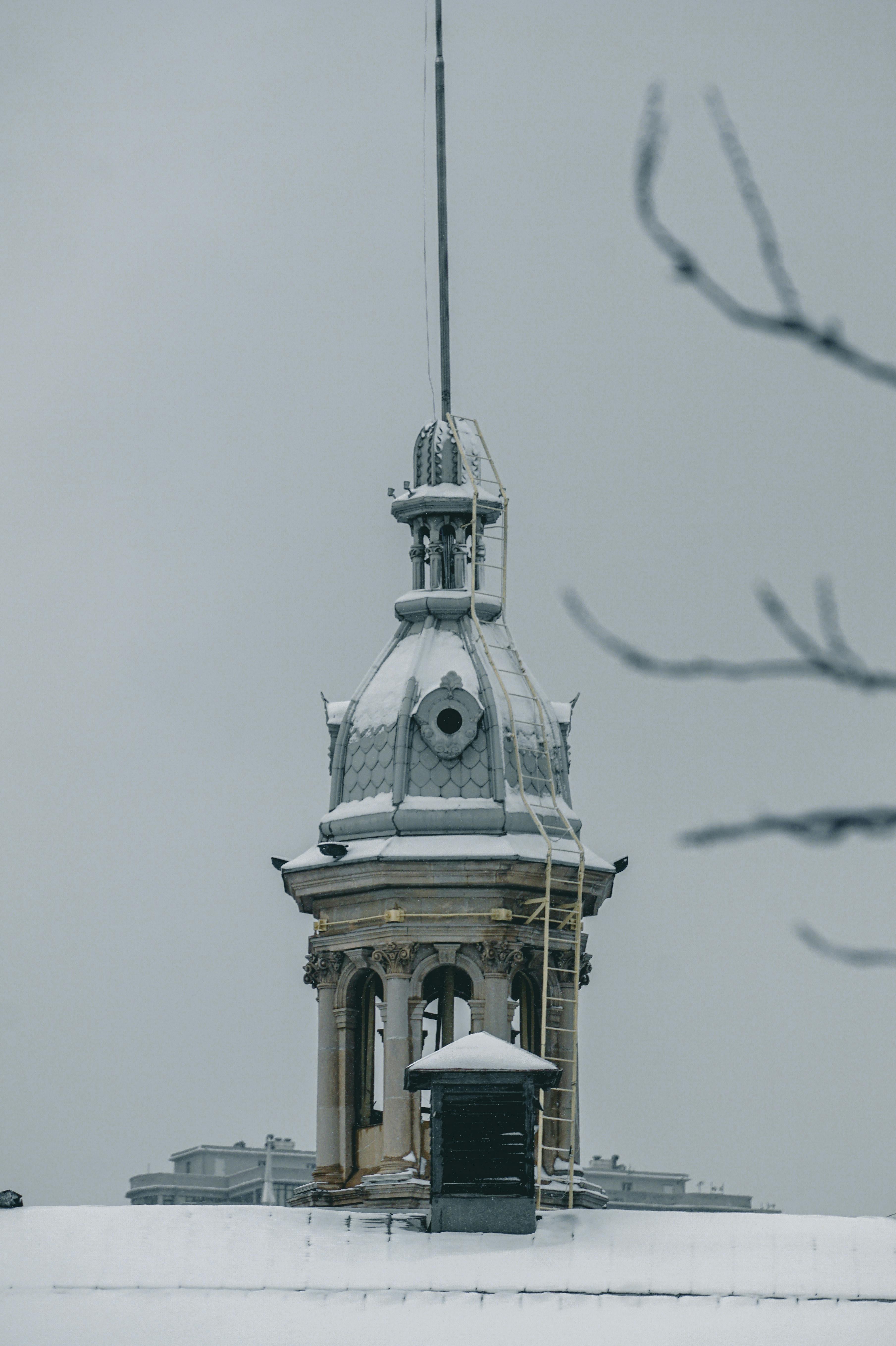 Snow on Building Tower · Free Stock Photo