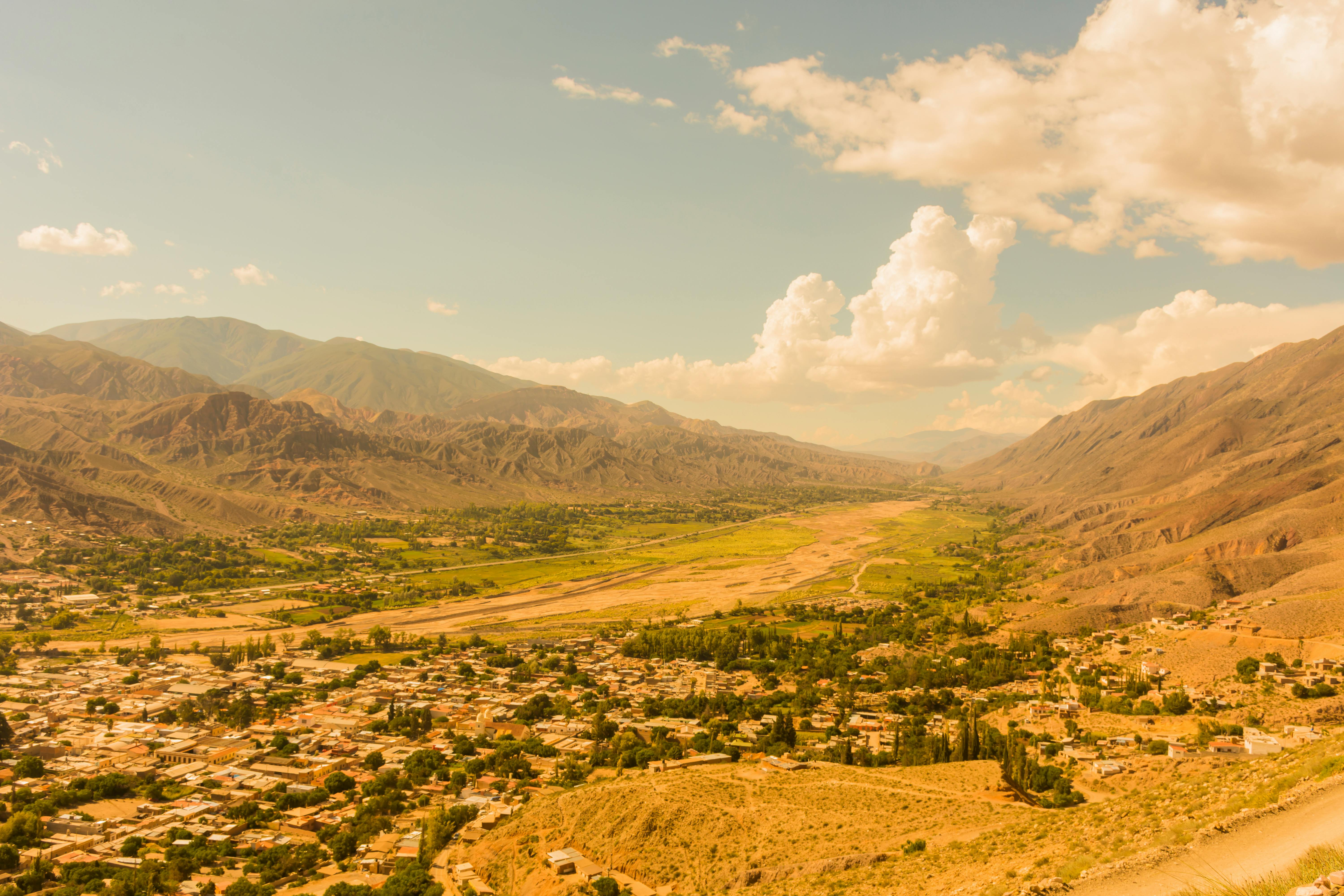 Town in Valley between Hills · Free Stock Photo