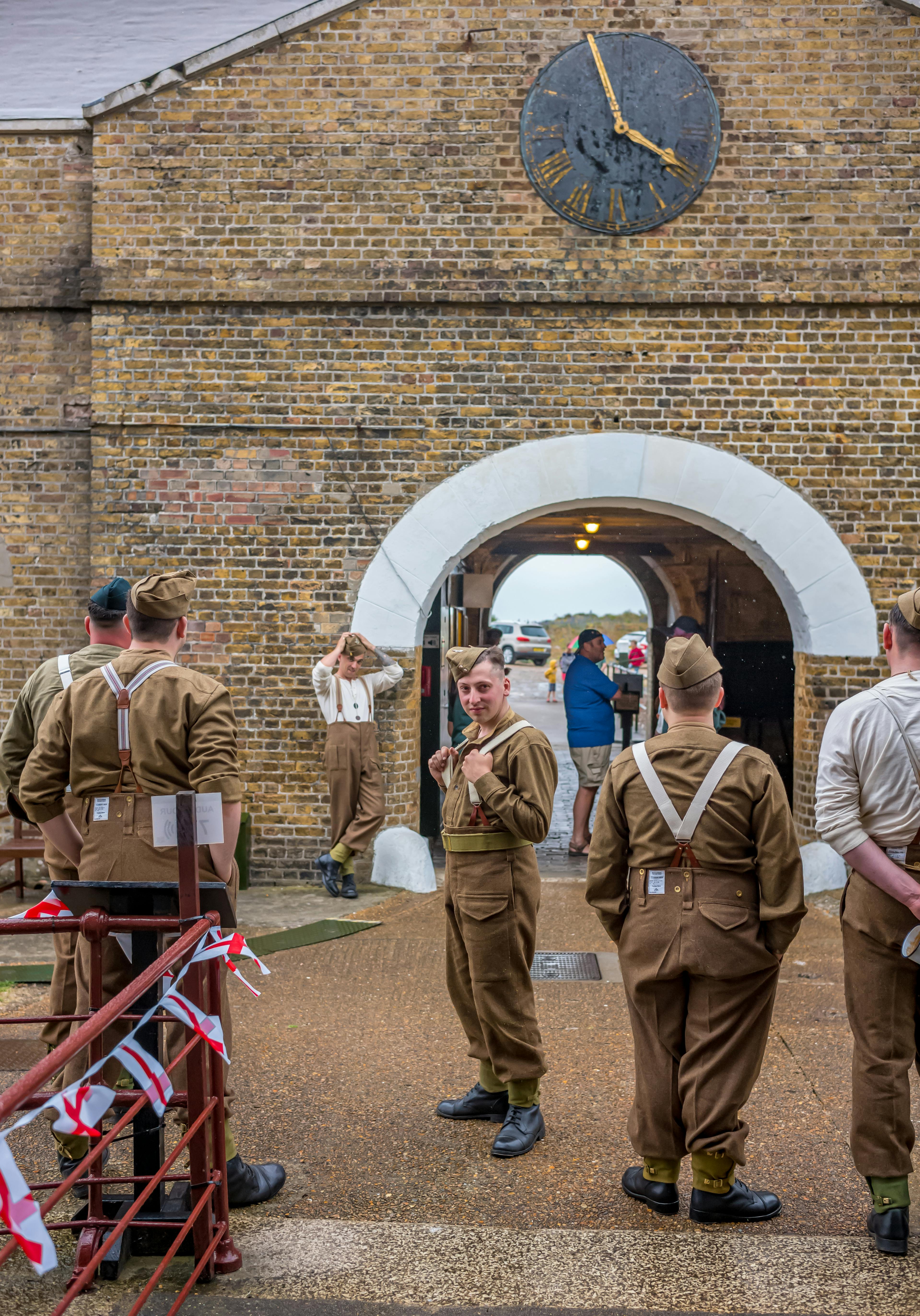 Group of Men in World War II British Uniforms by the Gate of Landguard ...