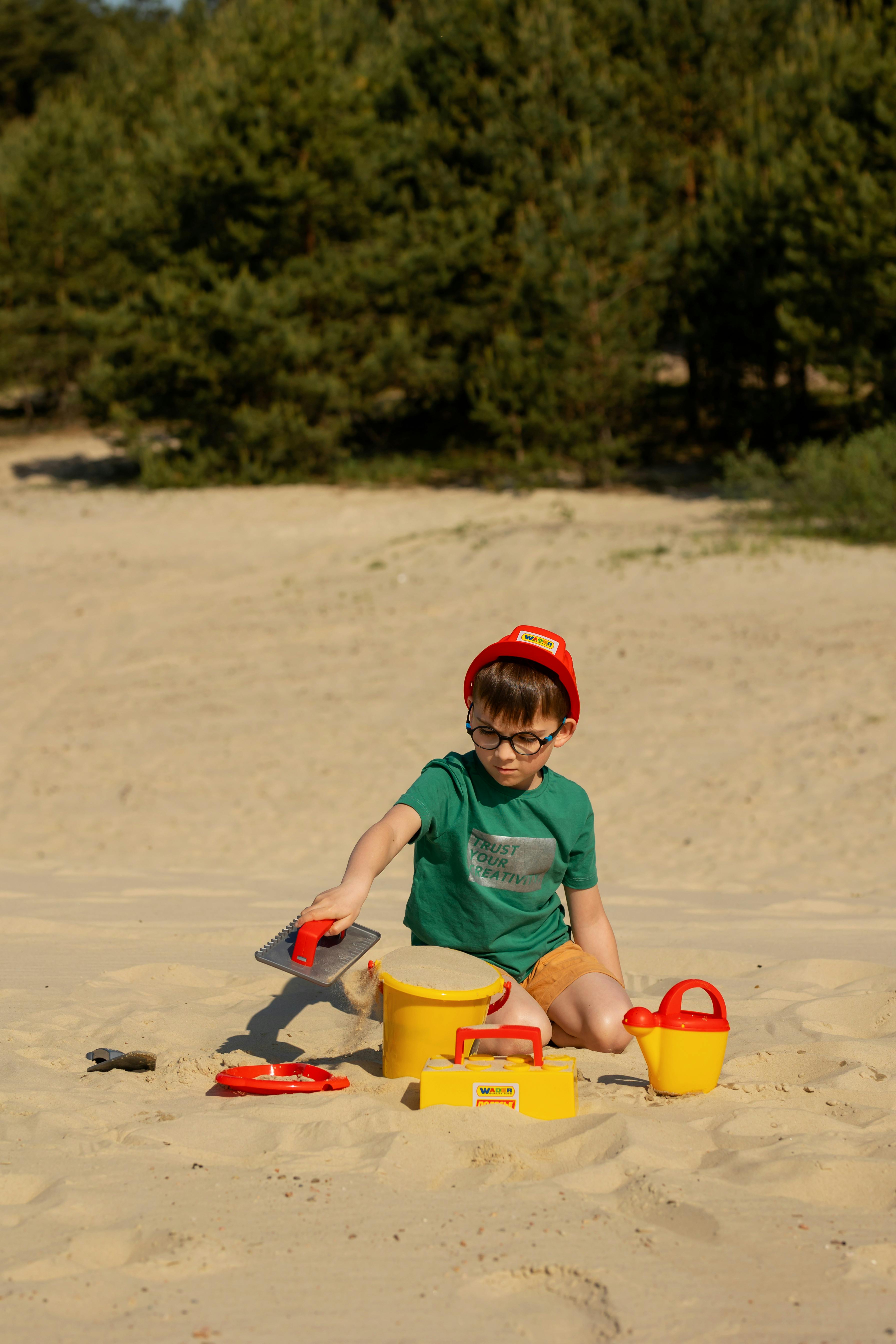 Boy Playing Sand on Beach · Free Stock Photo