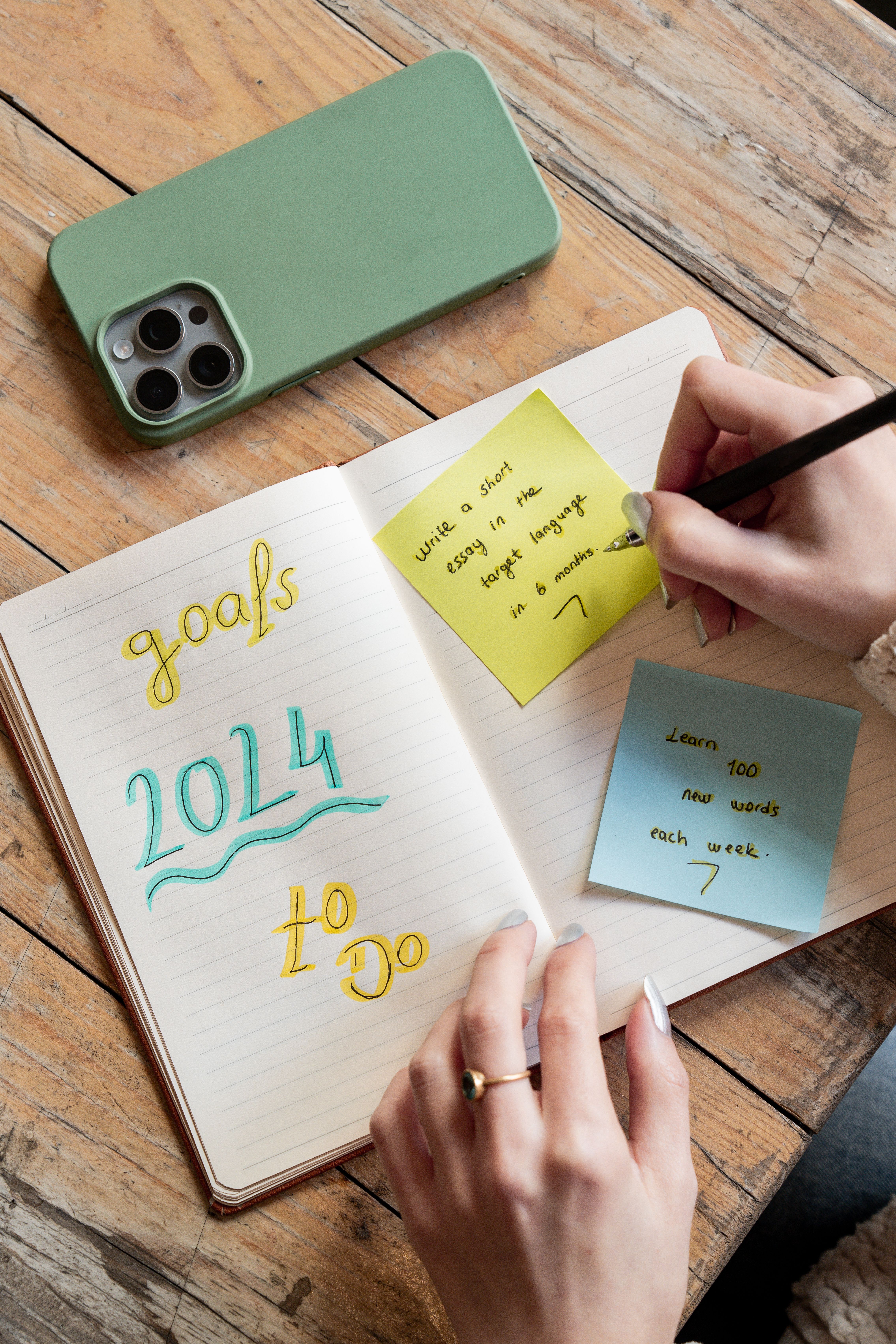 Woman Writing Notes for 2024 · Free Stock Photo