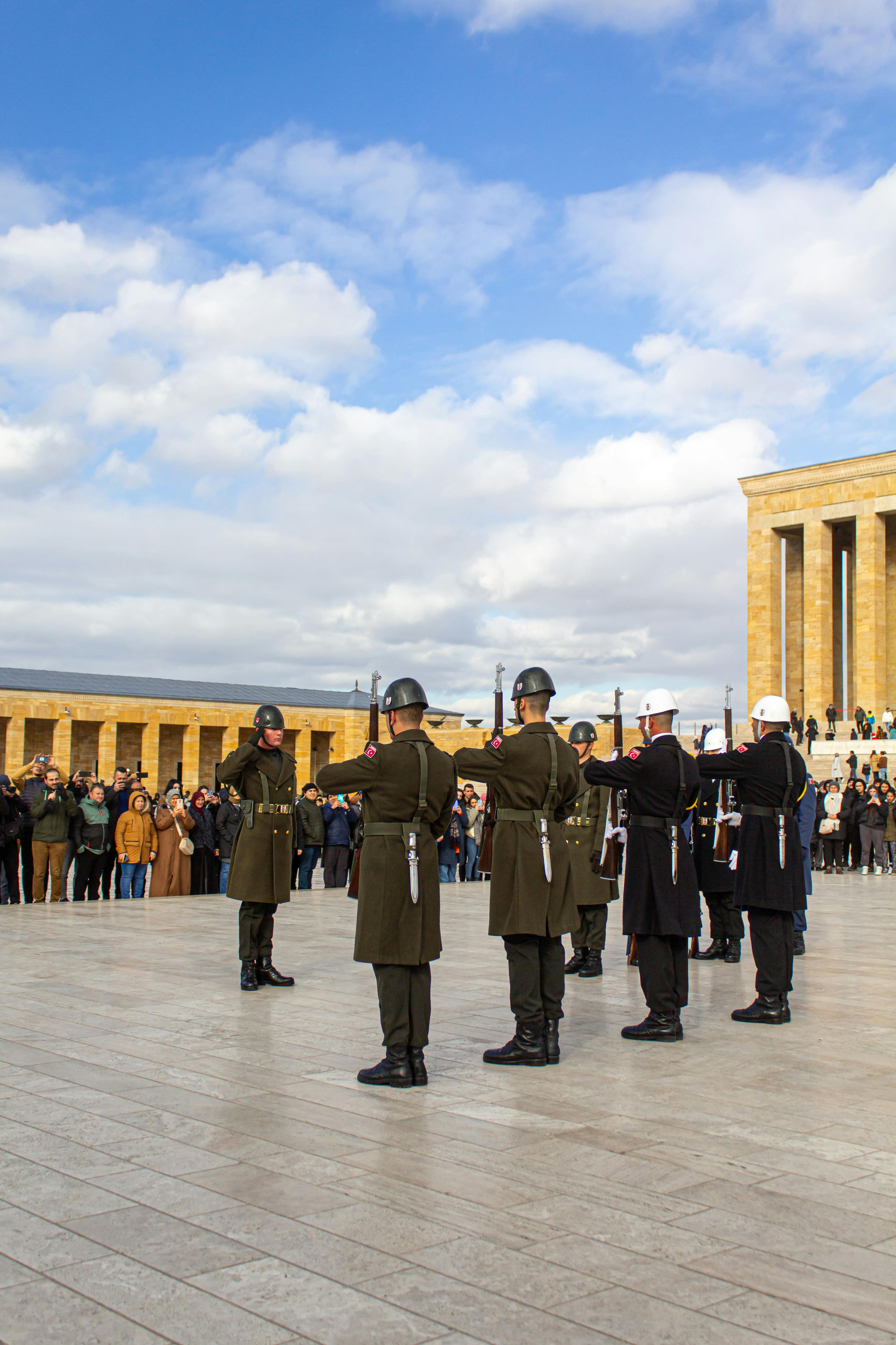 A group of soldiers in uniform stand in front of a building · Free ...