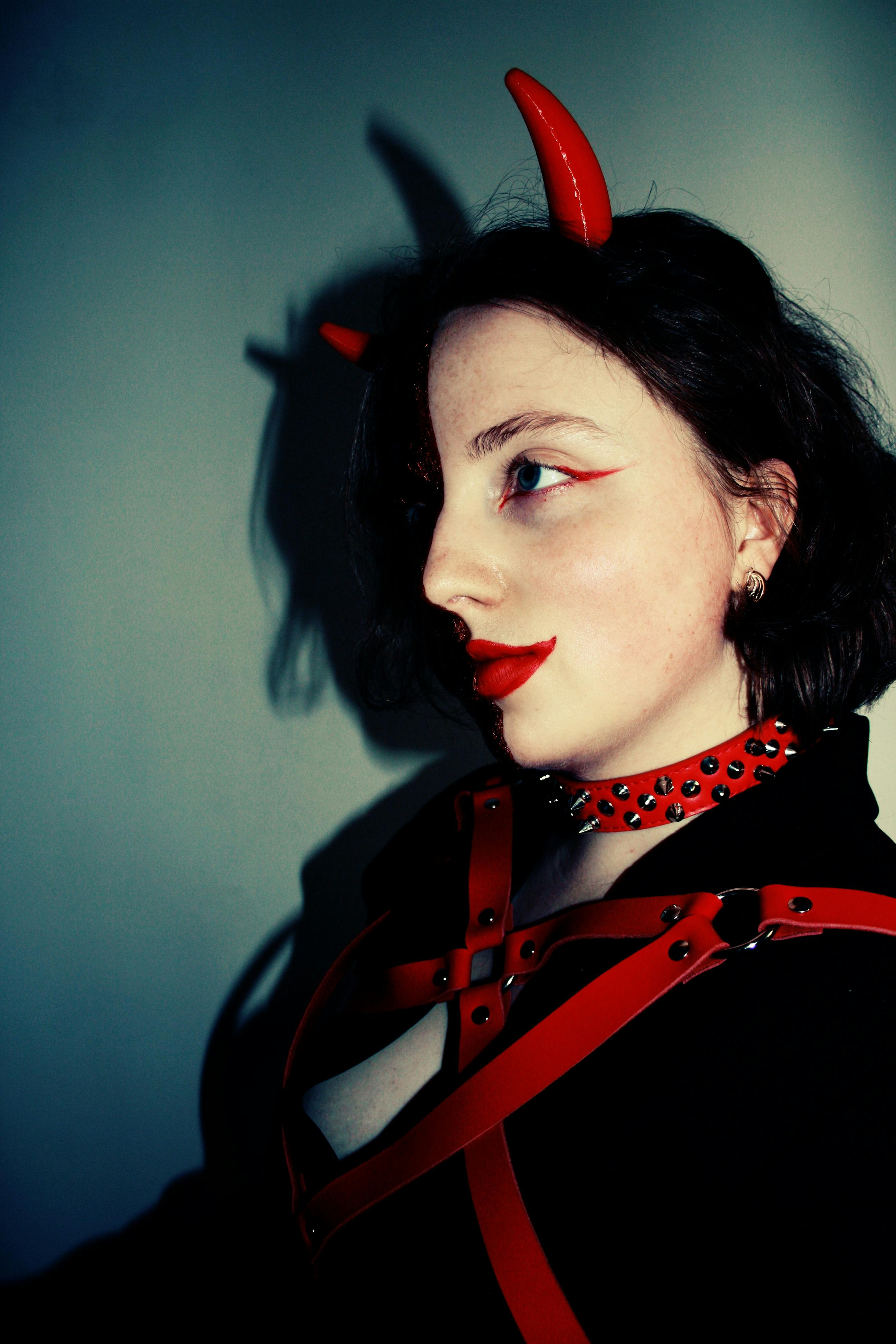 Photo of a Brunette Wearing a Devil Costume · Free Stock Photo