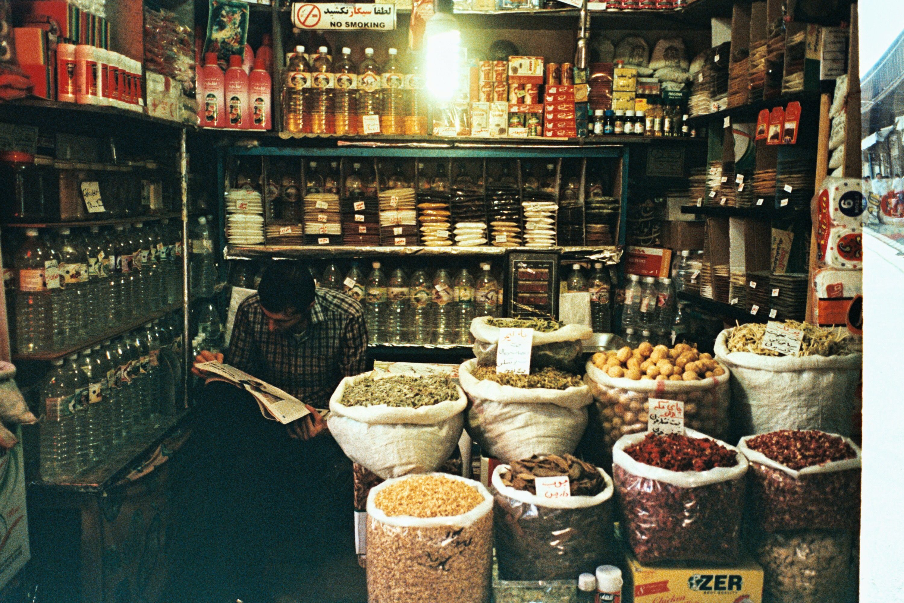 Seller Sitting at Bazaar · Free Stock Photo