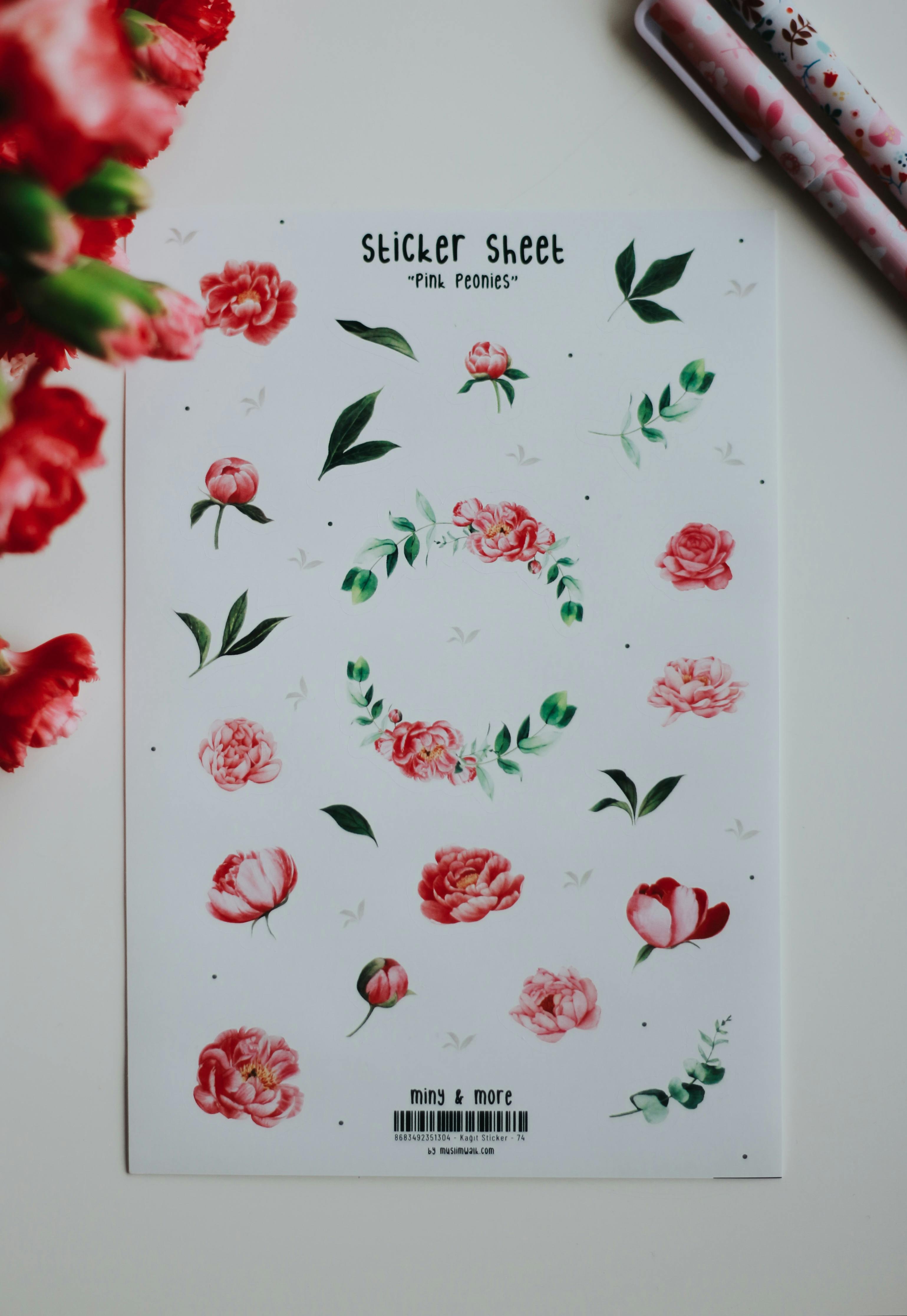 Pink Floral Stickers on a Desk · Free Stock Photo