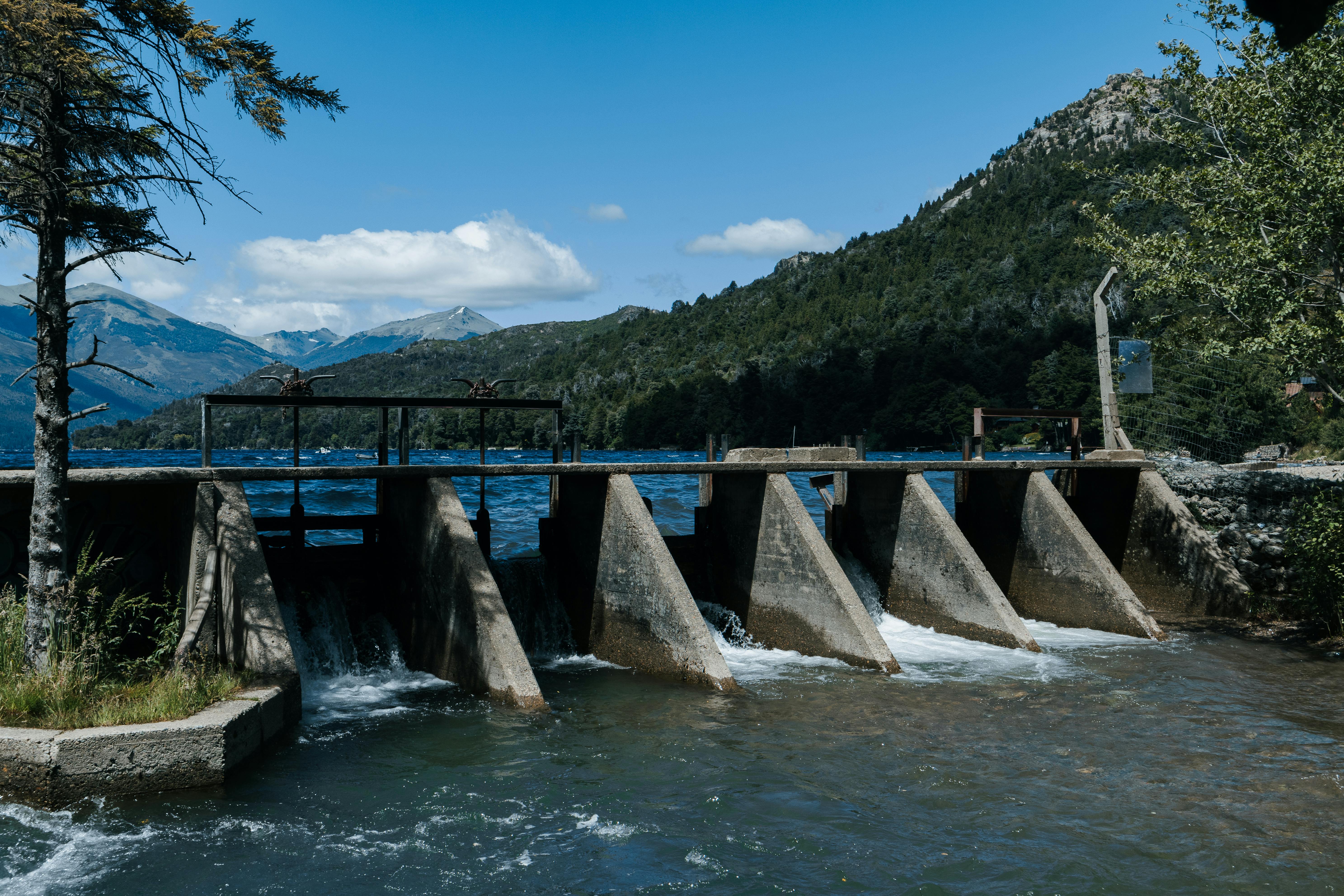 Landscape with a Dam on a River · Free Stock Photo