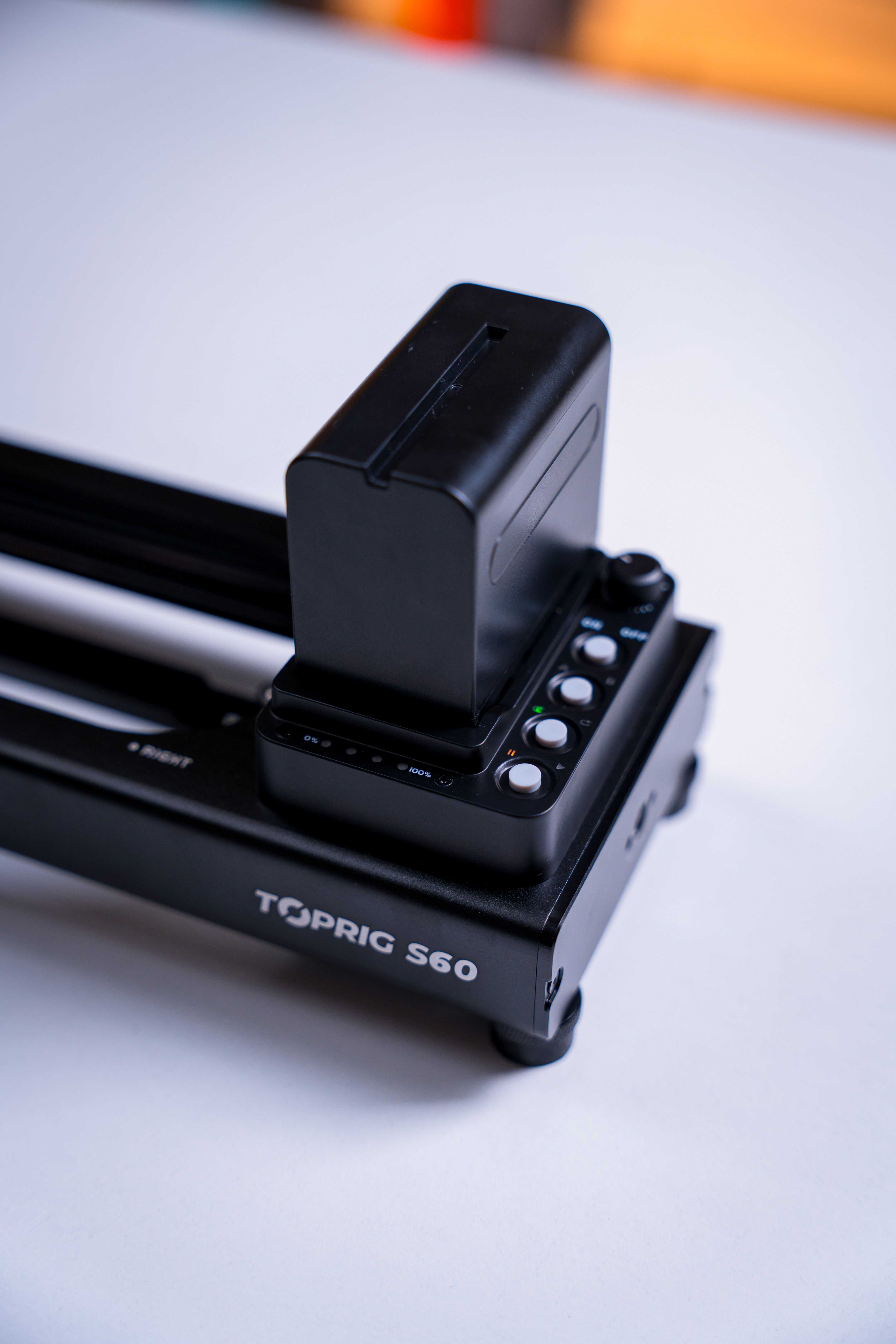 A camera with a battery on top of it · Free Stock Photo