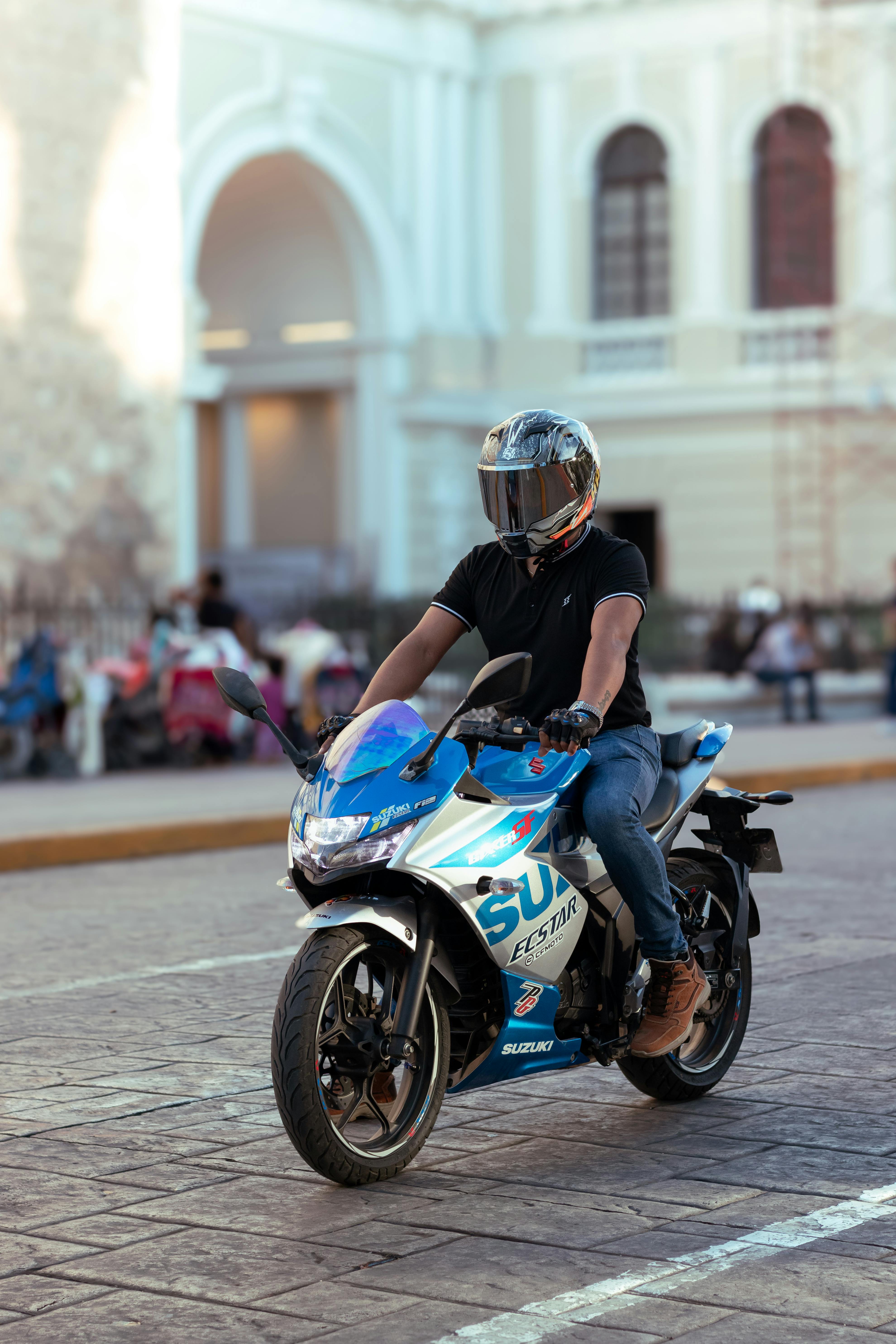 Man Riding Red Suzuki Hayabusa · Free Stock Photo