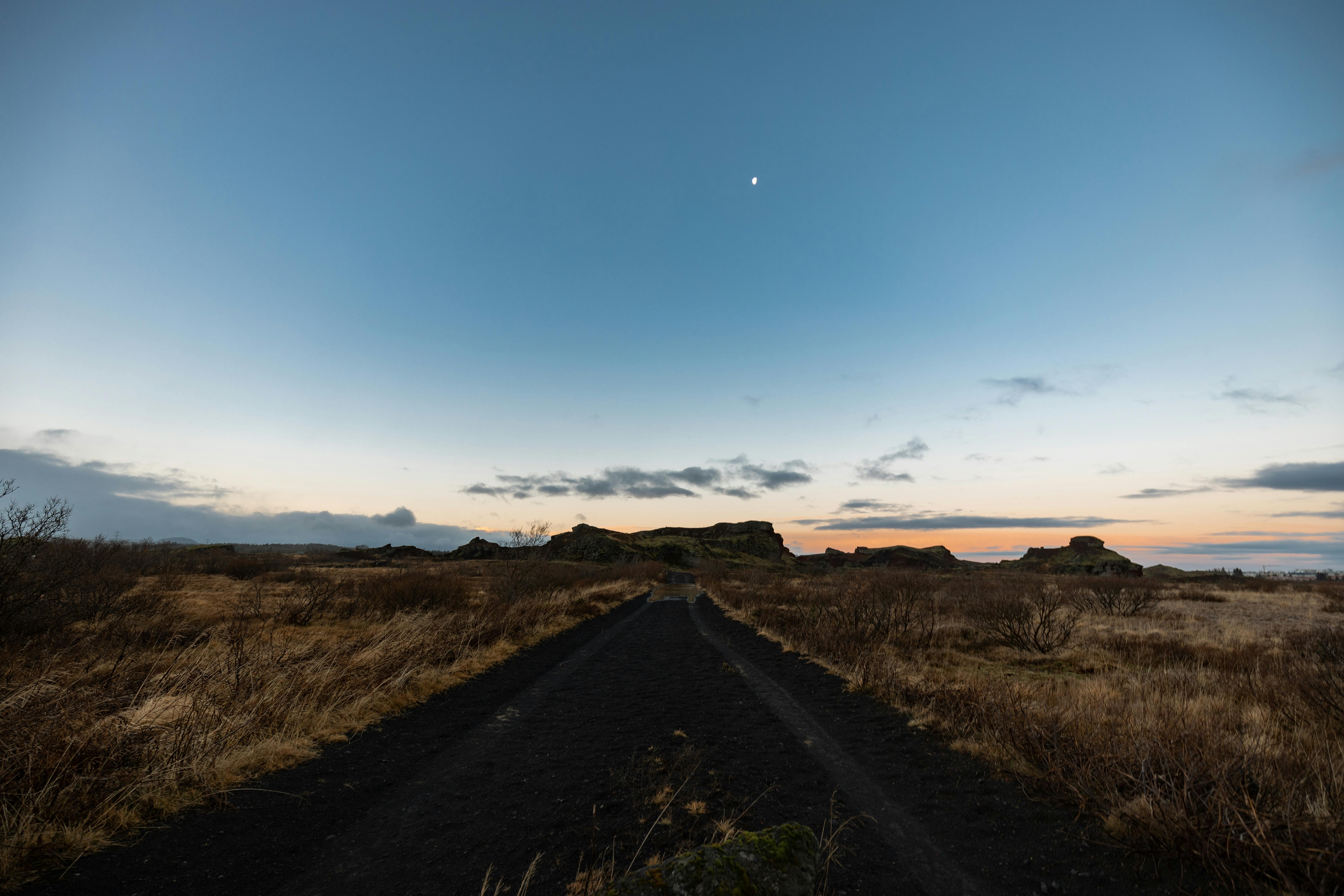 Dirt Road Through the Countryside at Dusk · Free Stock Photo