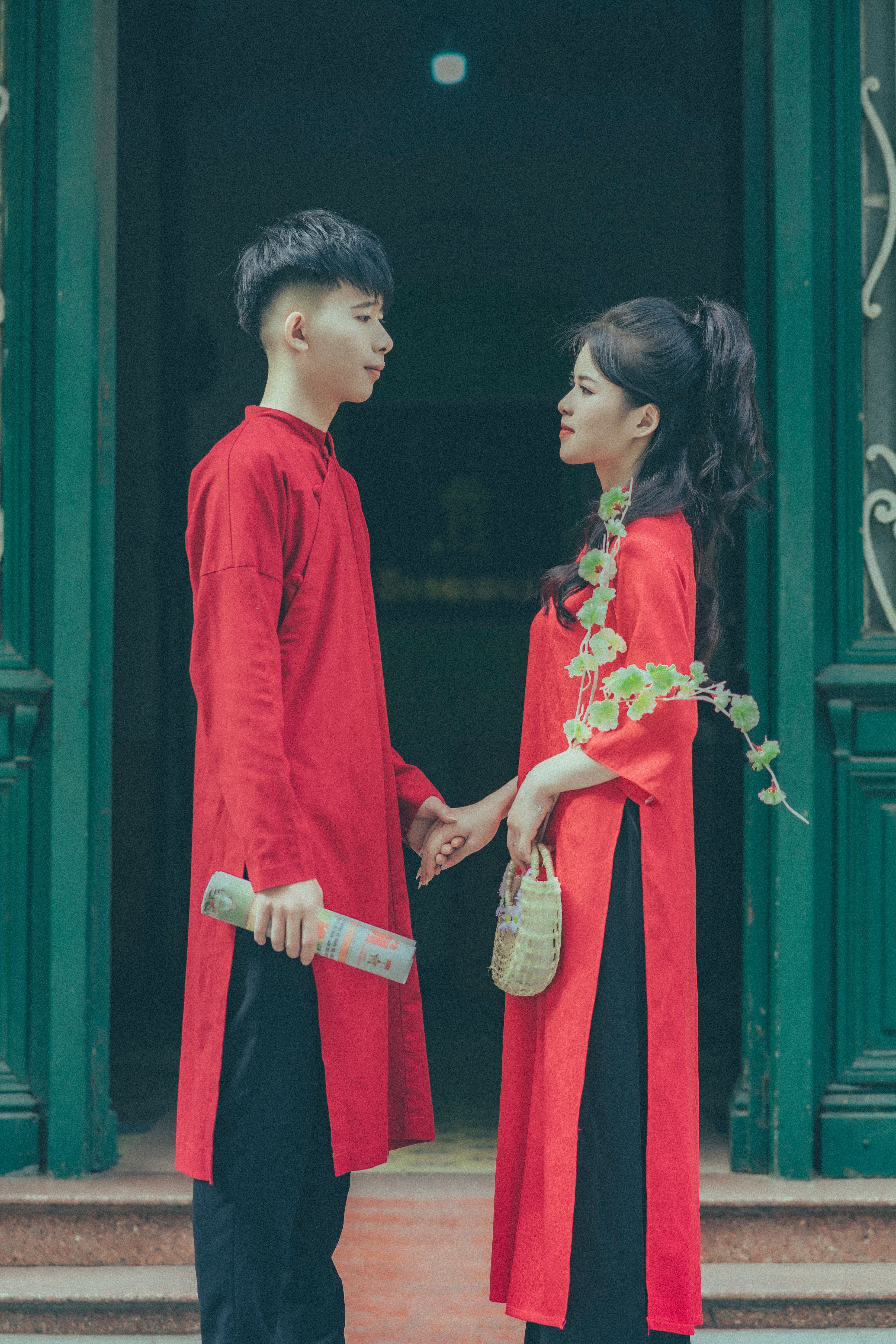 Couple Wearing Red Gowns in a Temple · Free Stock Photo
