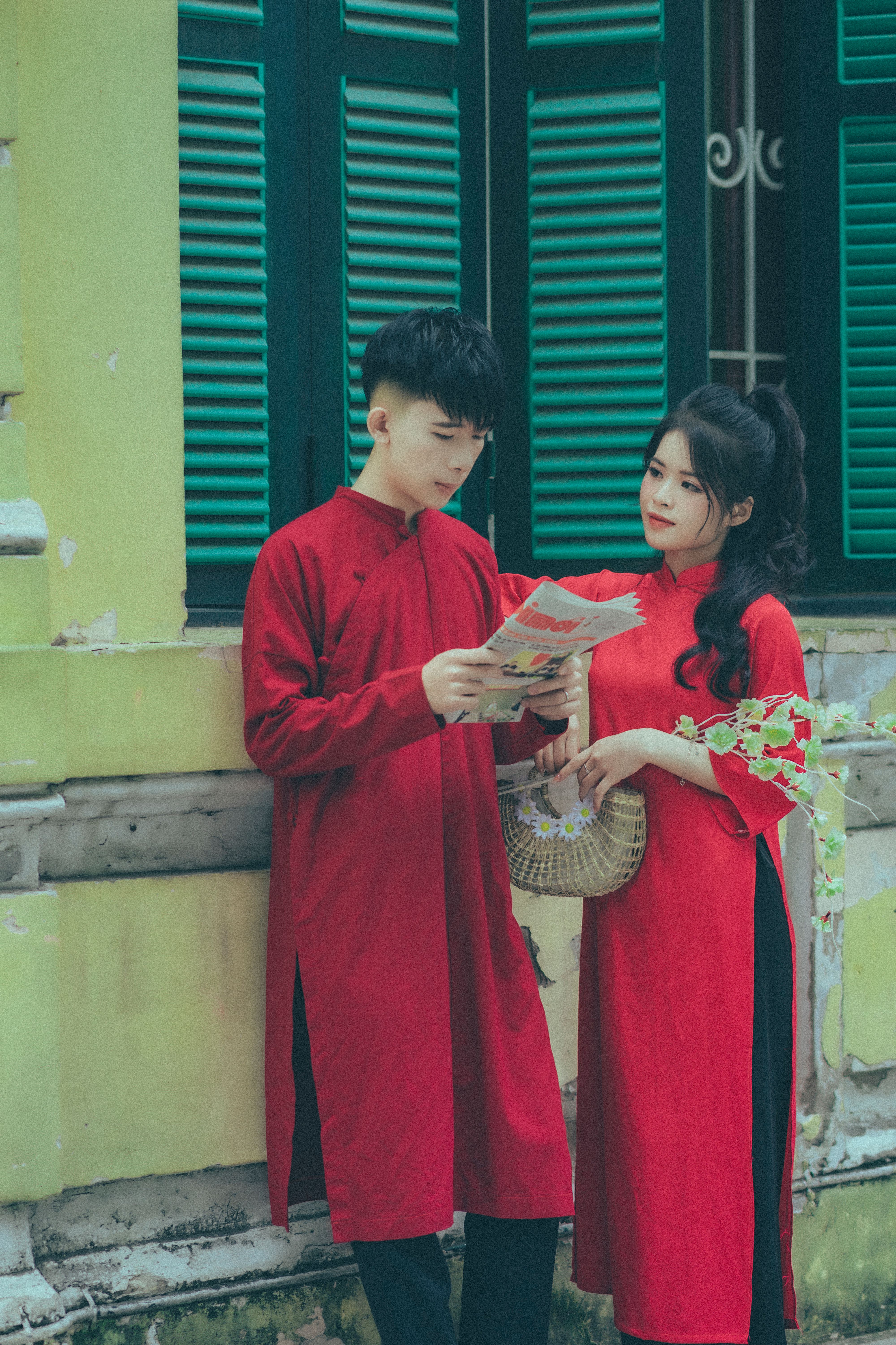 Couple Wearing Red Gowns on a Street · Free Stock Photo