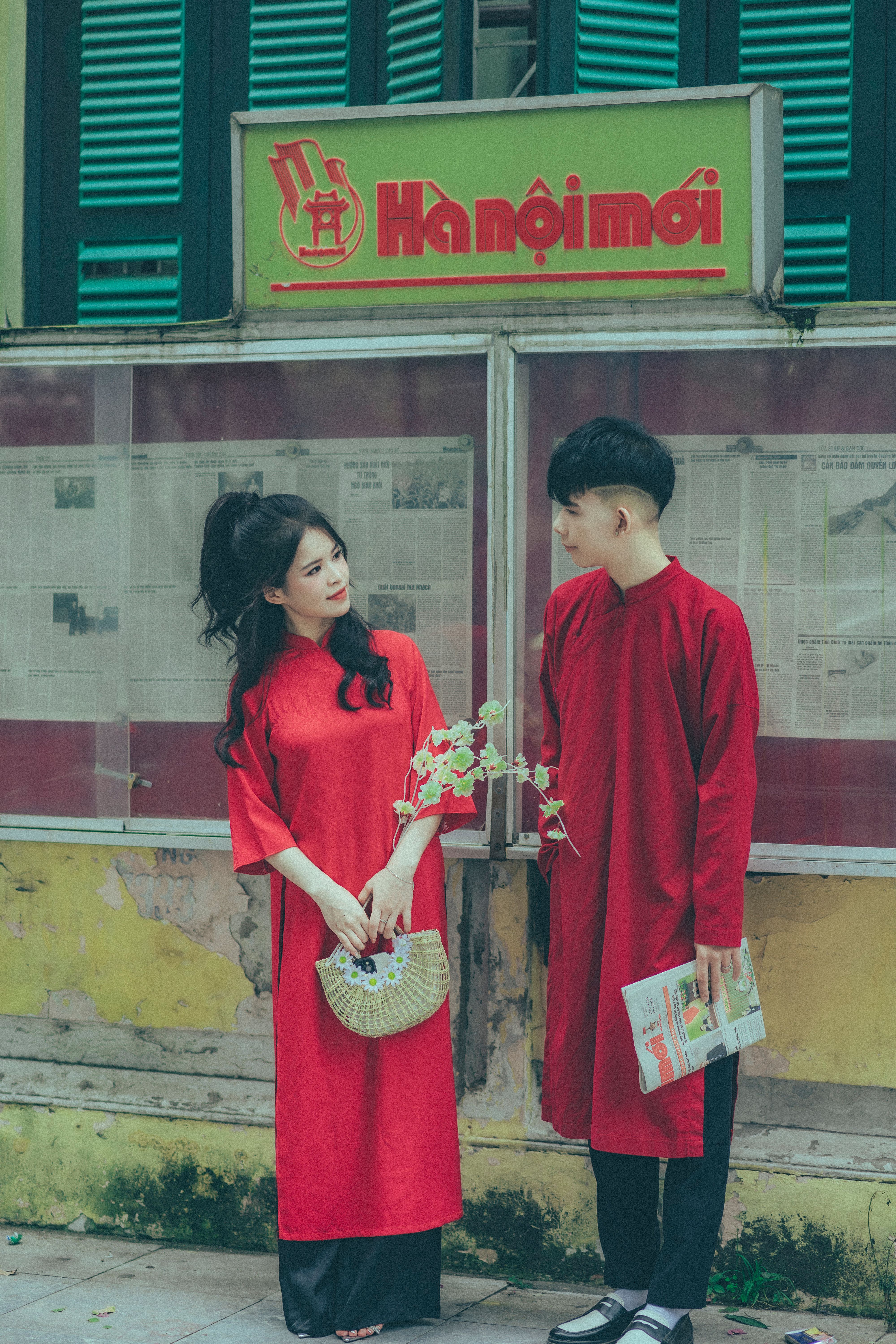 Couple Wearing Red Gowns on a Street · Free Stock Photo