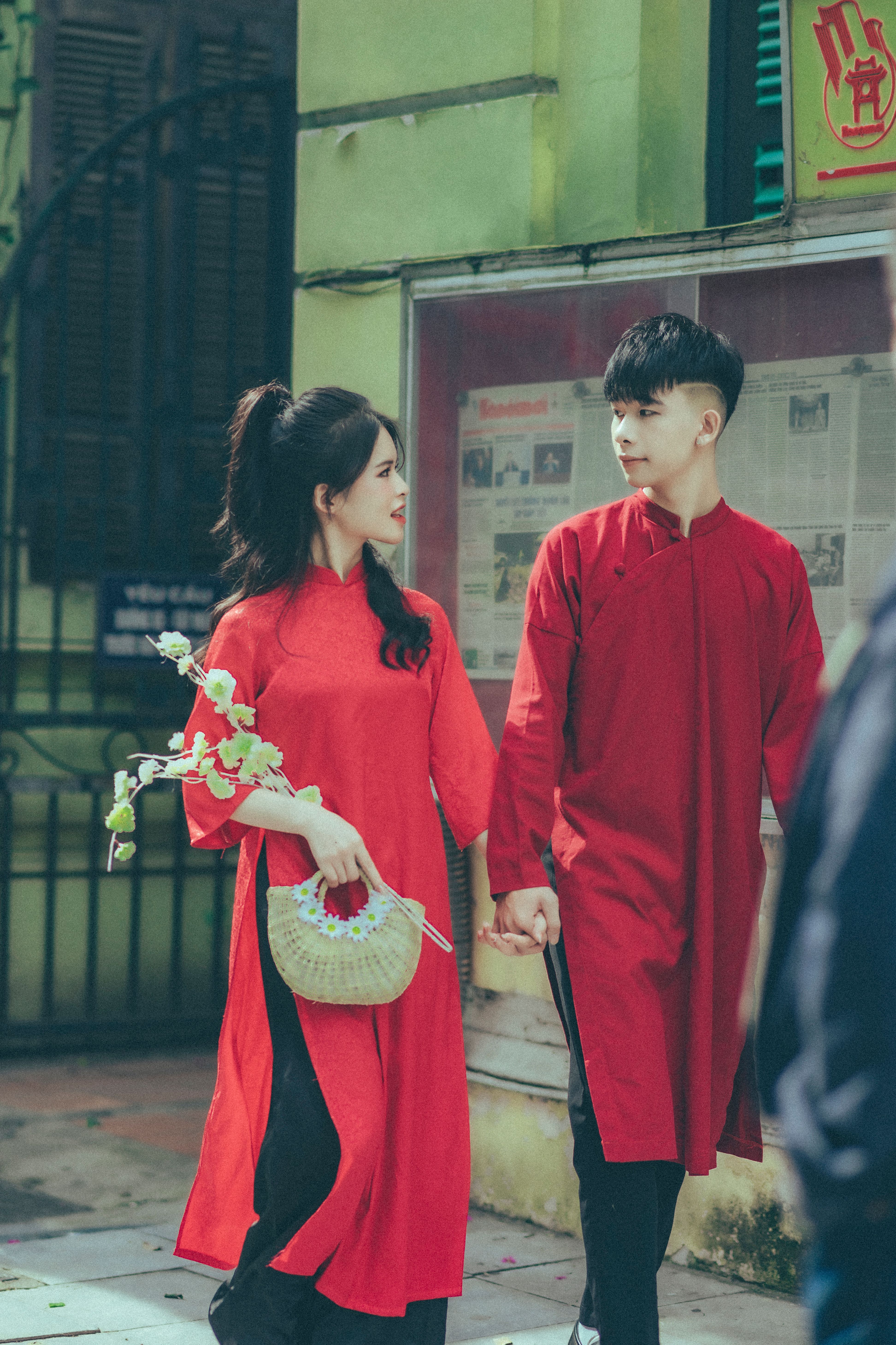 Couple Wearing Red Gowns on a Street · Free Stock Photo