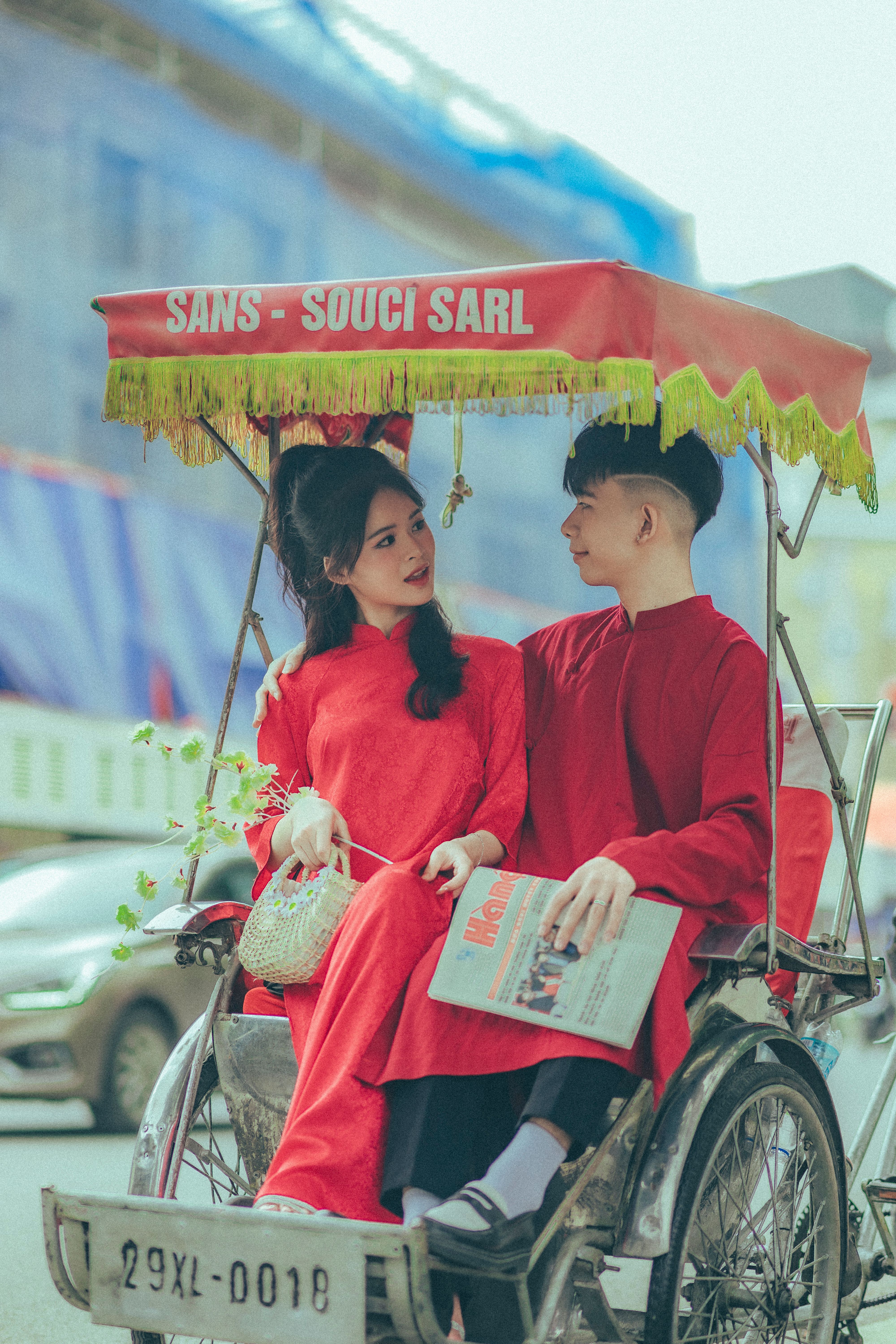 Couple in Traditional Clothing Sitting on Rickshaw · Free Stock Photo