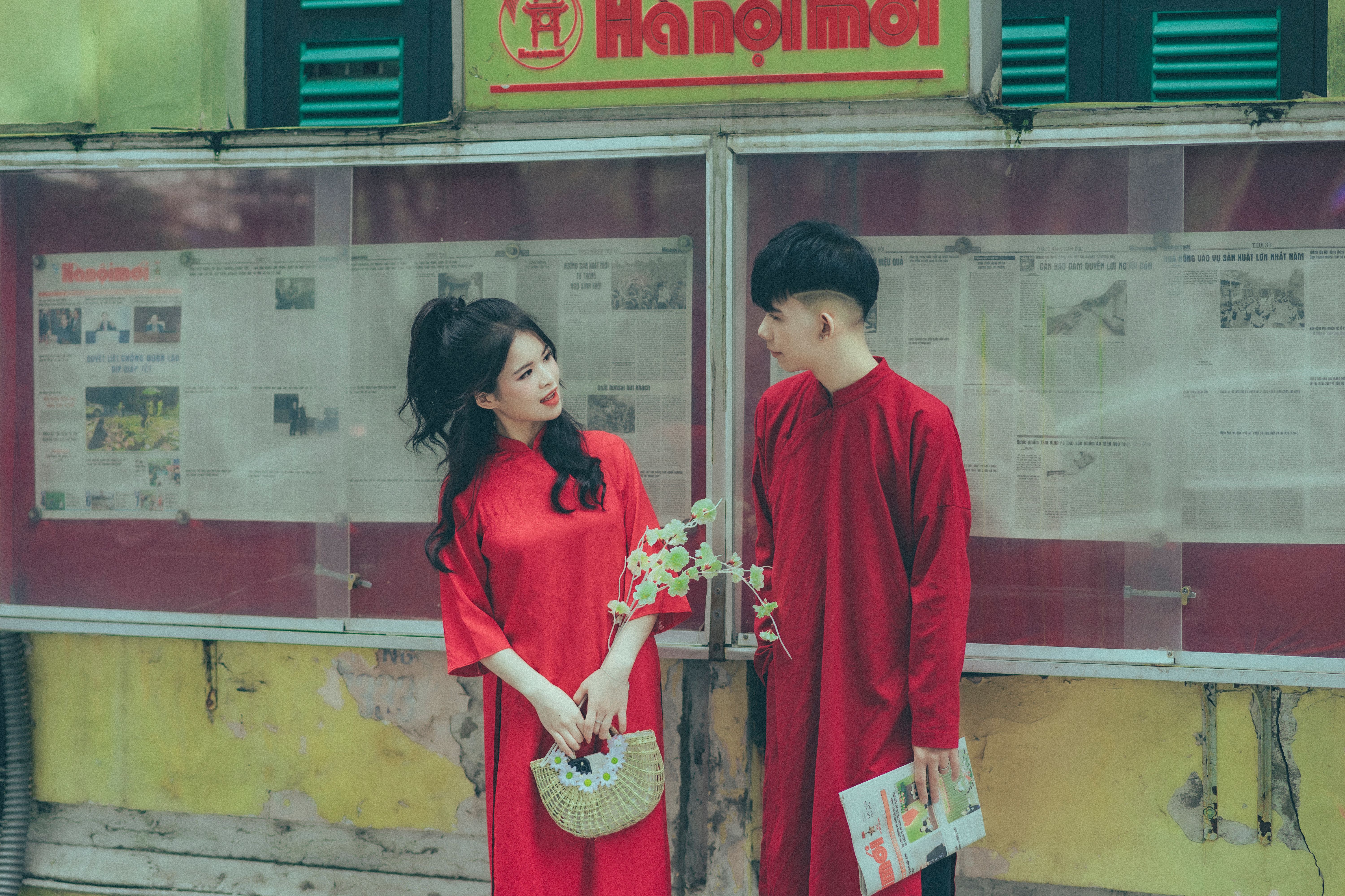 Couple Wearing Red Gowns on a Street · Free Stock Photo