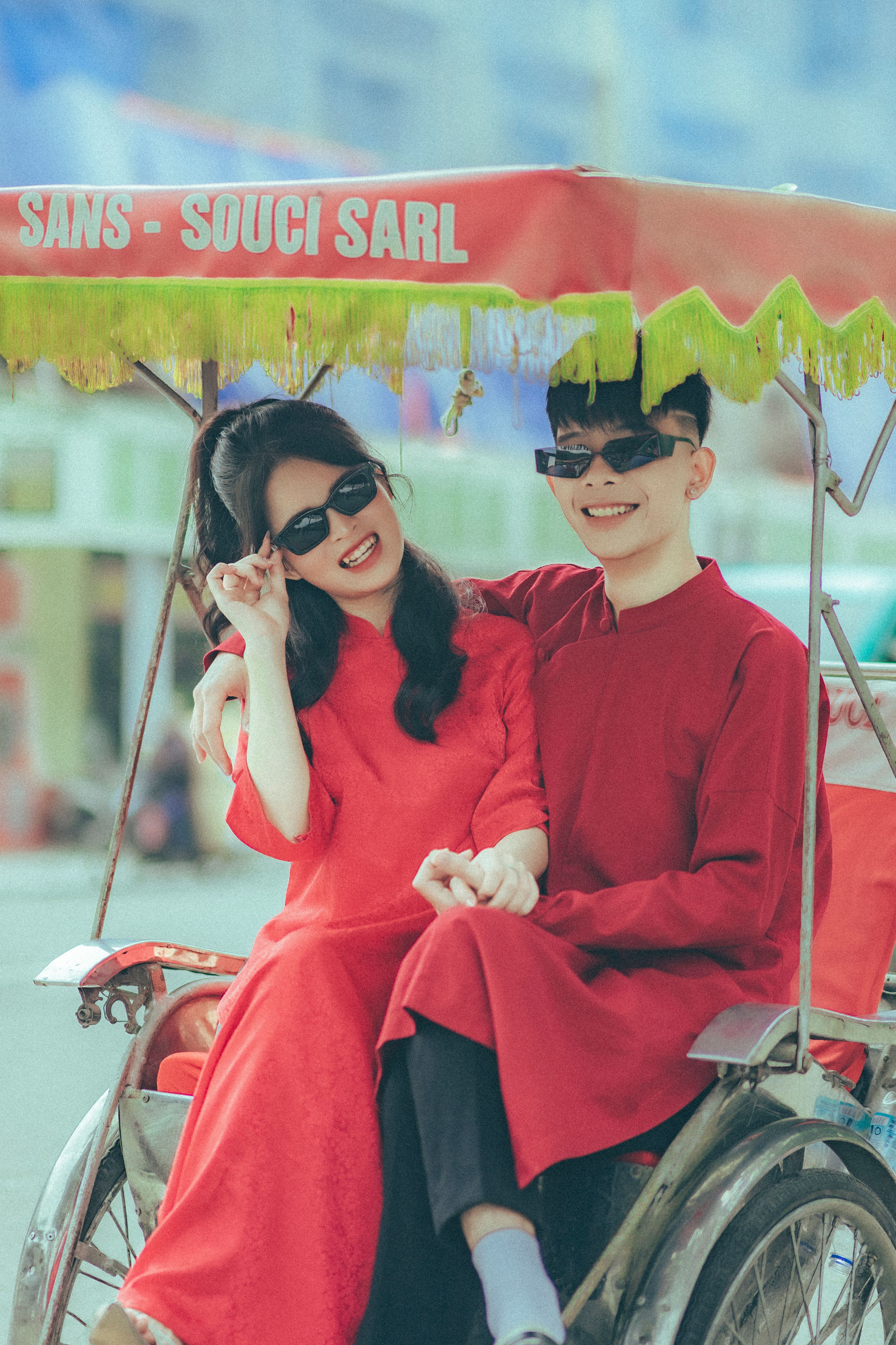 Couple Wearing Red Gowns on a Street · Free Stock Photo
