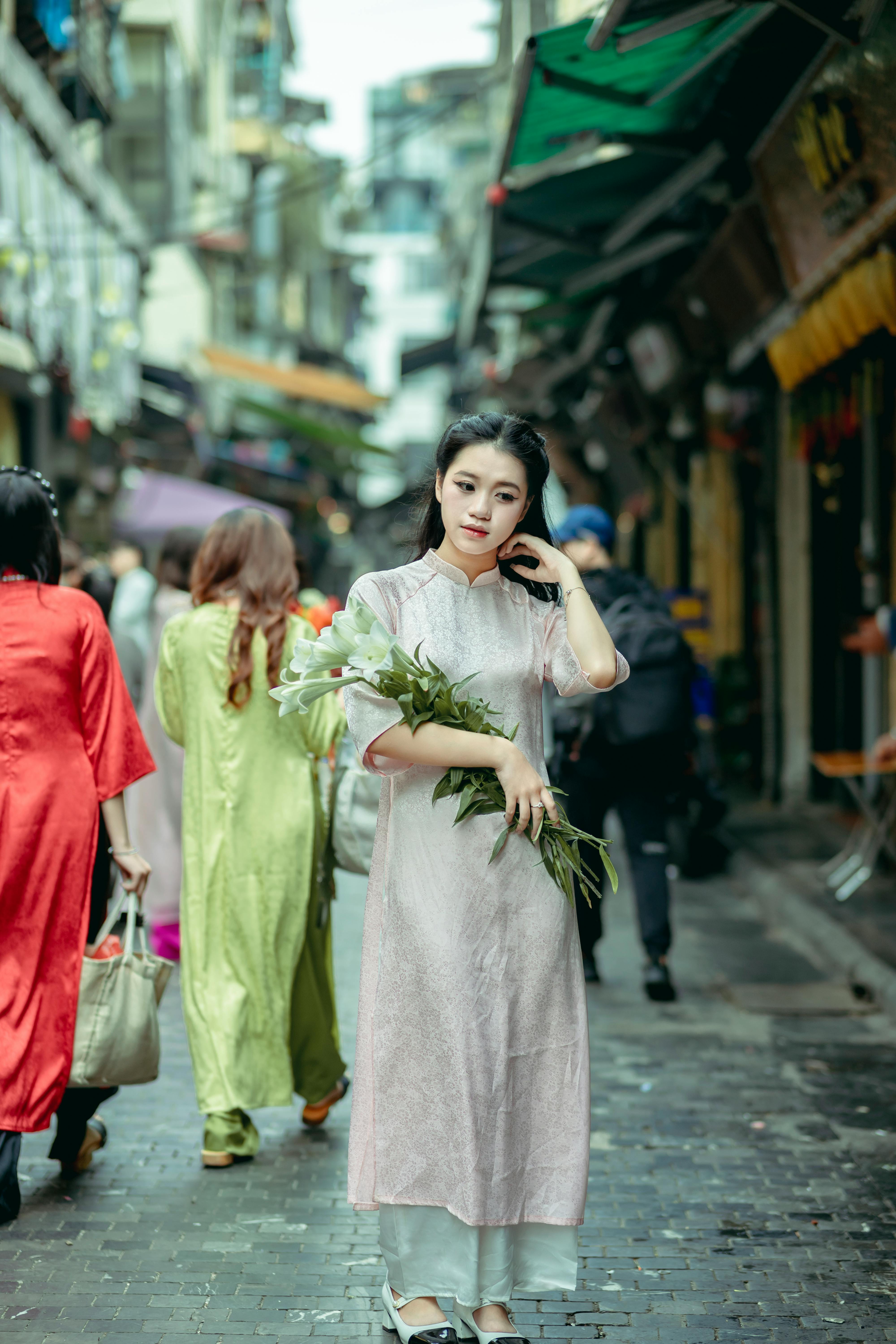 Woman in Traditional Clothing in Town · Free Stock Photo