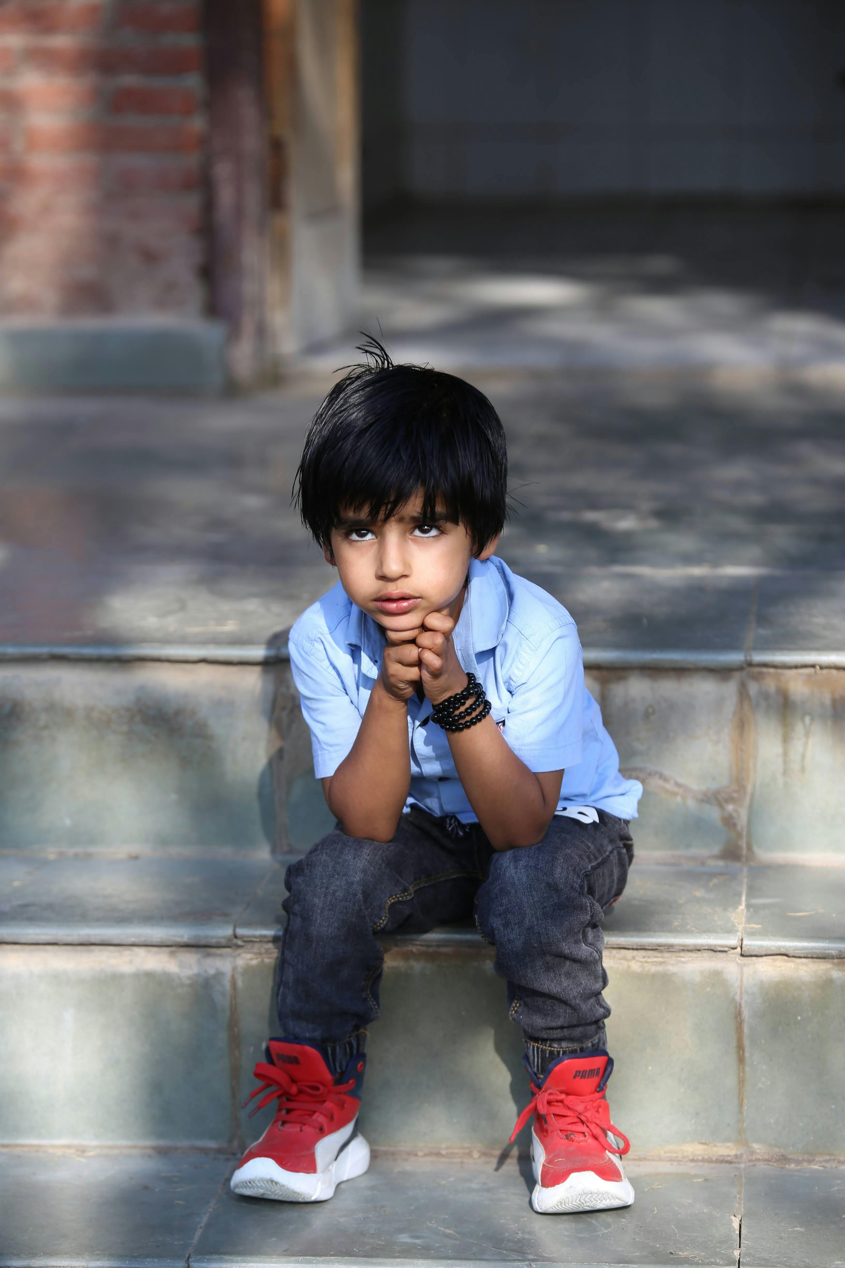 Little Boy Sitting on Stairs by the Street · Free Stock Photo
