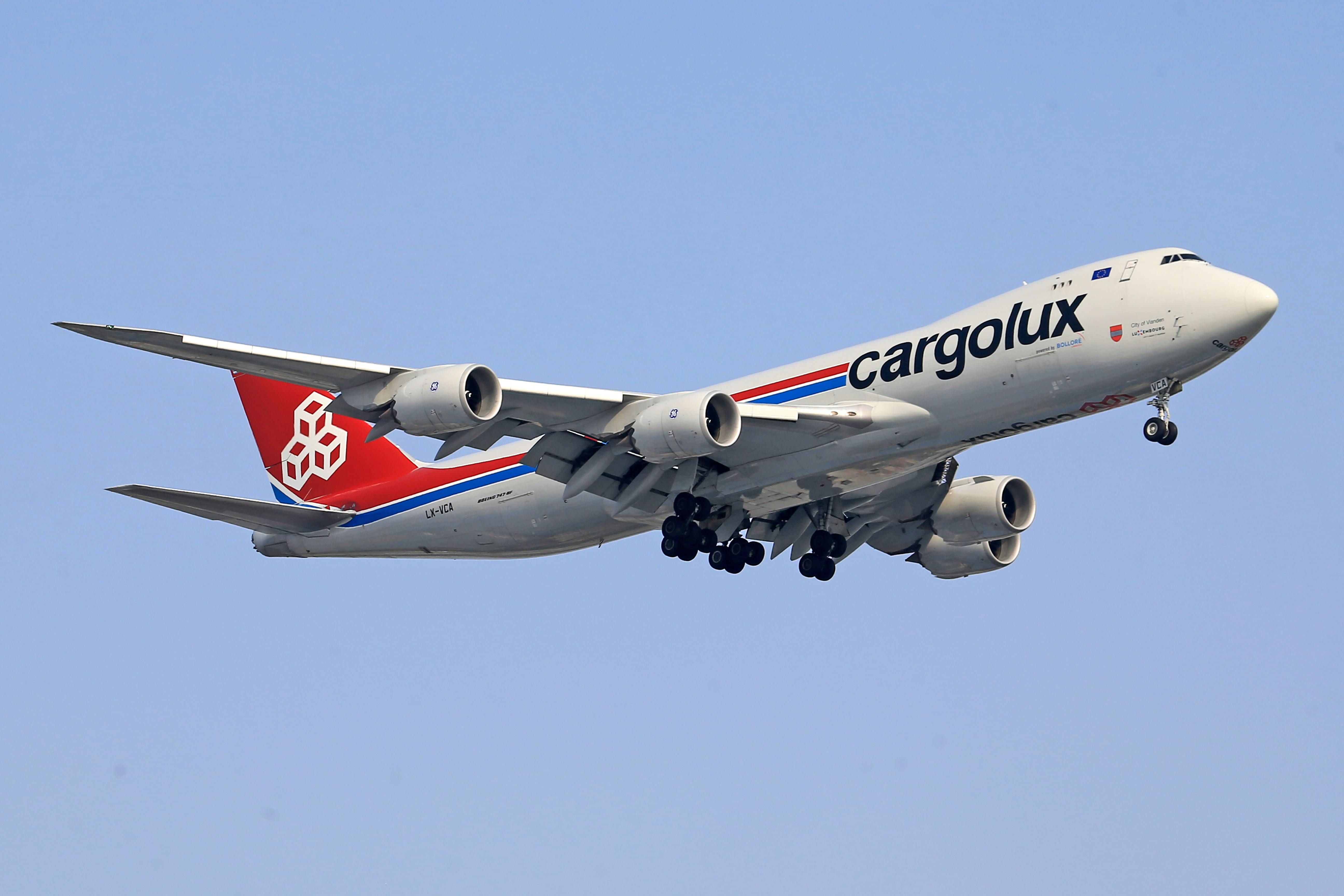 A large airplane flying in the sky · Free Stock Photo