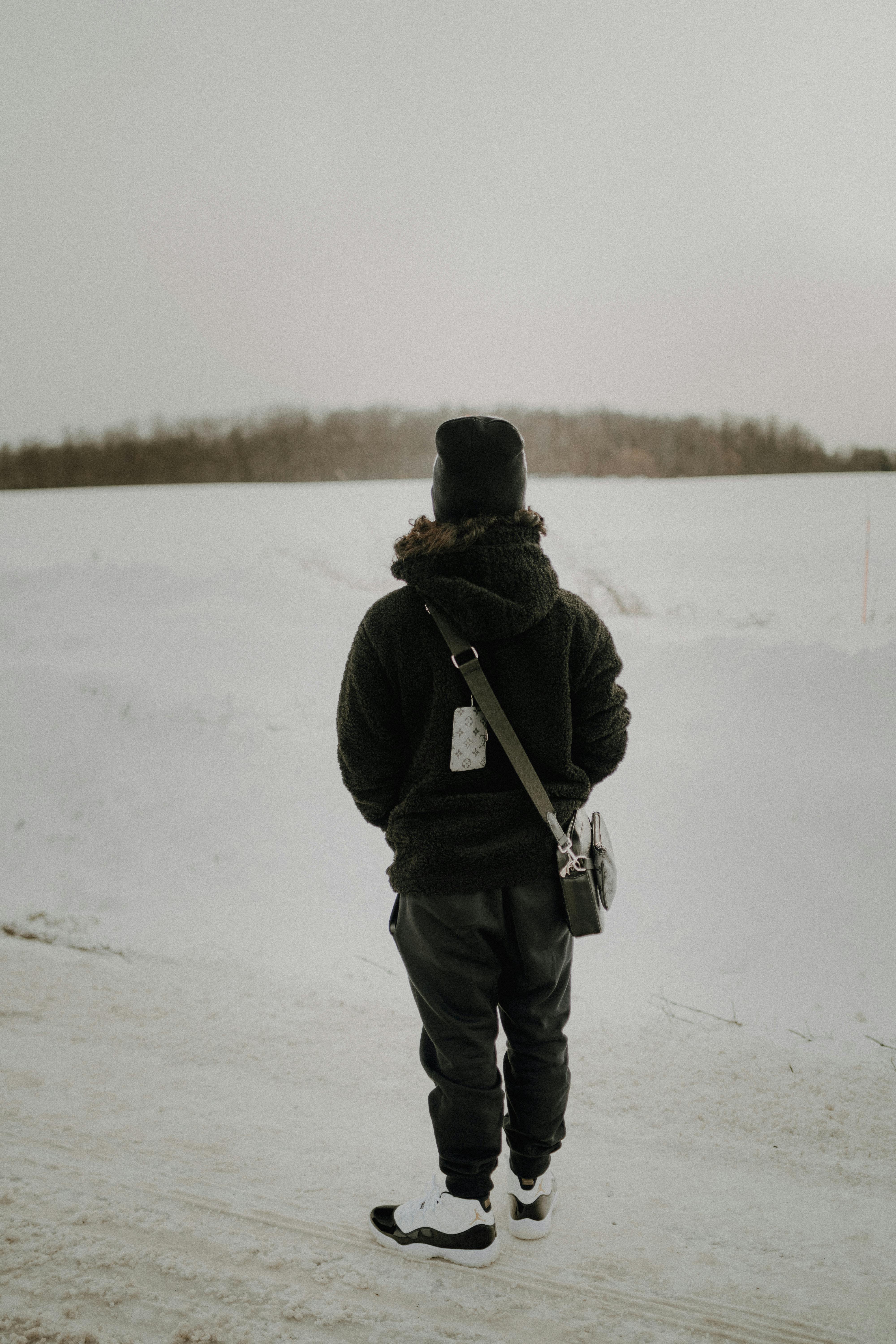 Back View of Man on Road in Snow · Free Stock Photo