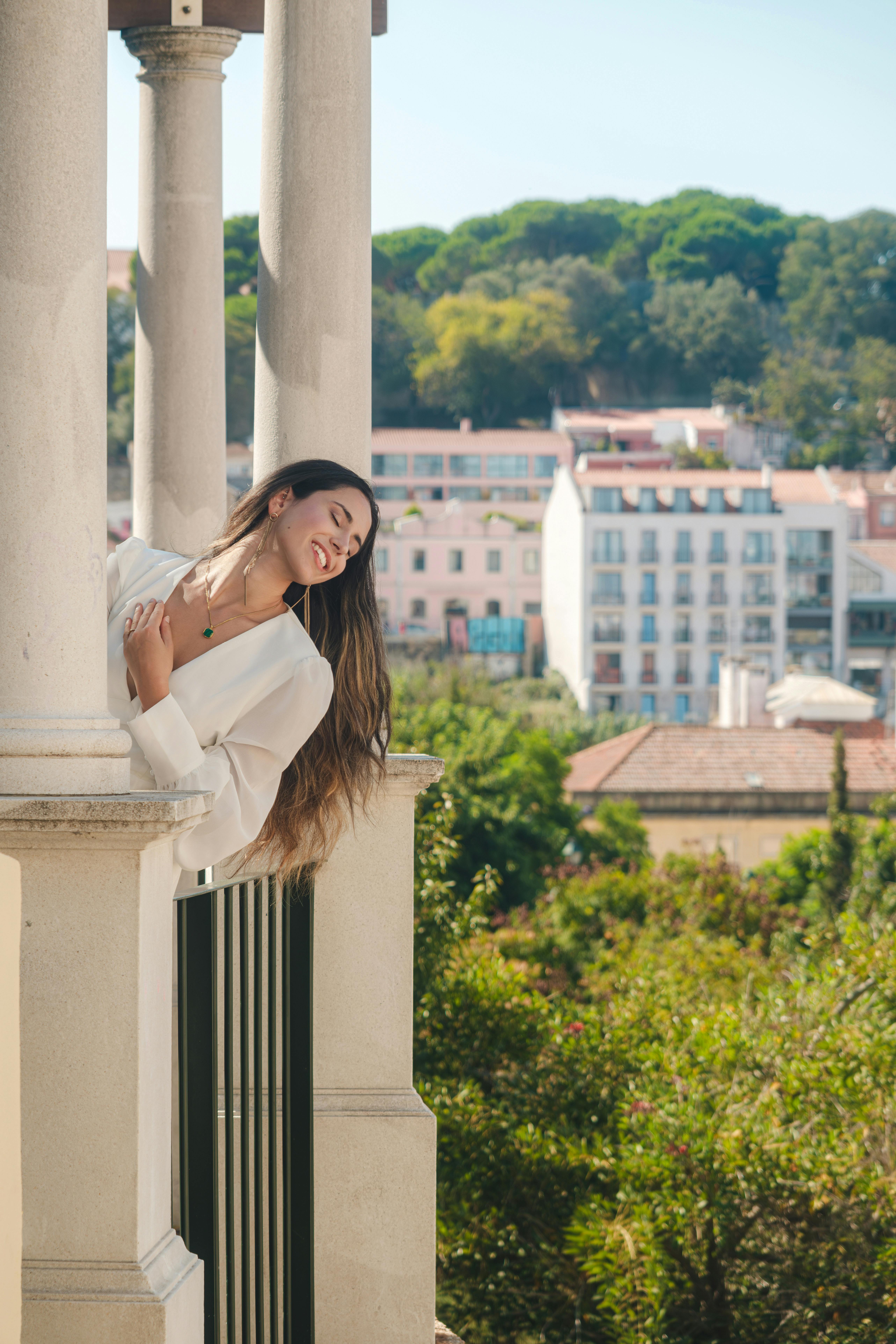 Smiling Woman Leaning over Railing · Free Stock Photo