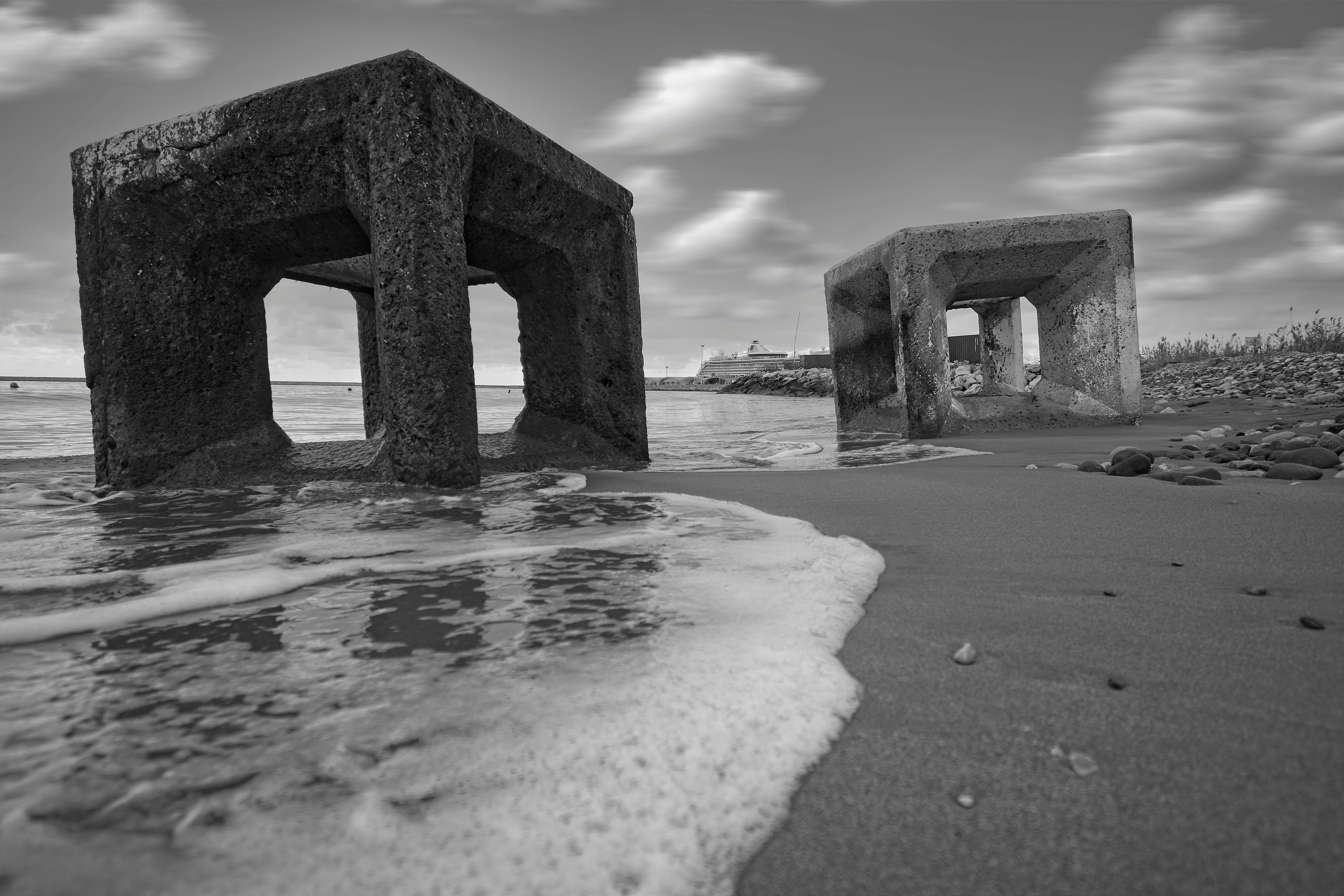 Concrete Blocks on Beach in Black and White · Free Stock Photo
