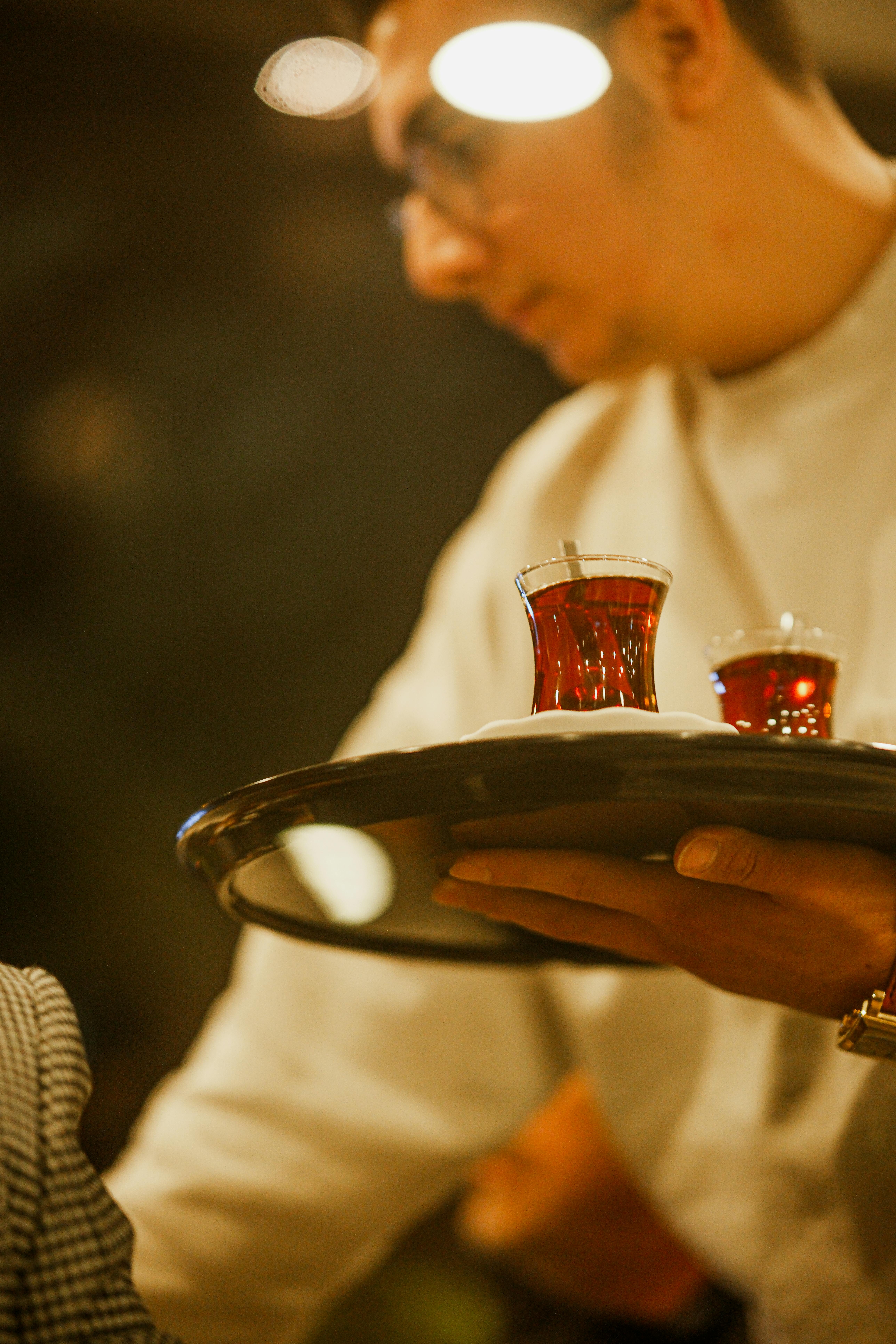 Waiter Serving Tea in Glasses · Free Stock Photo