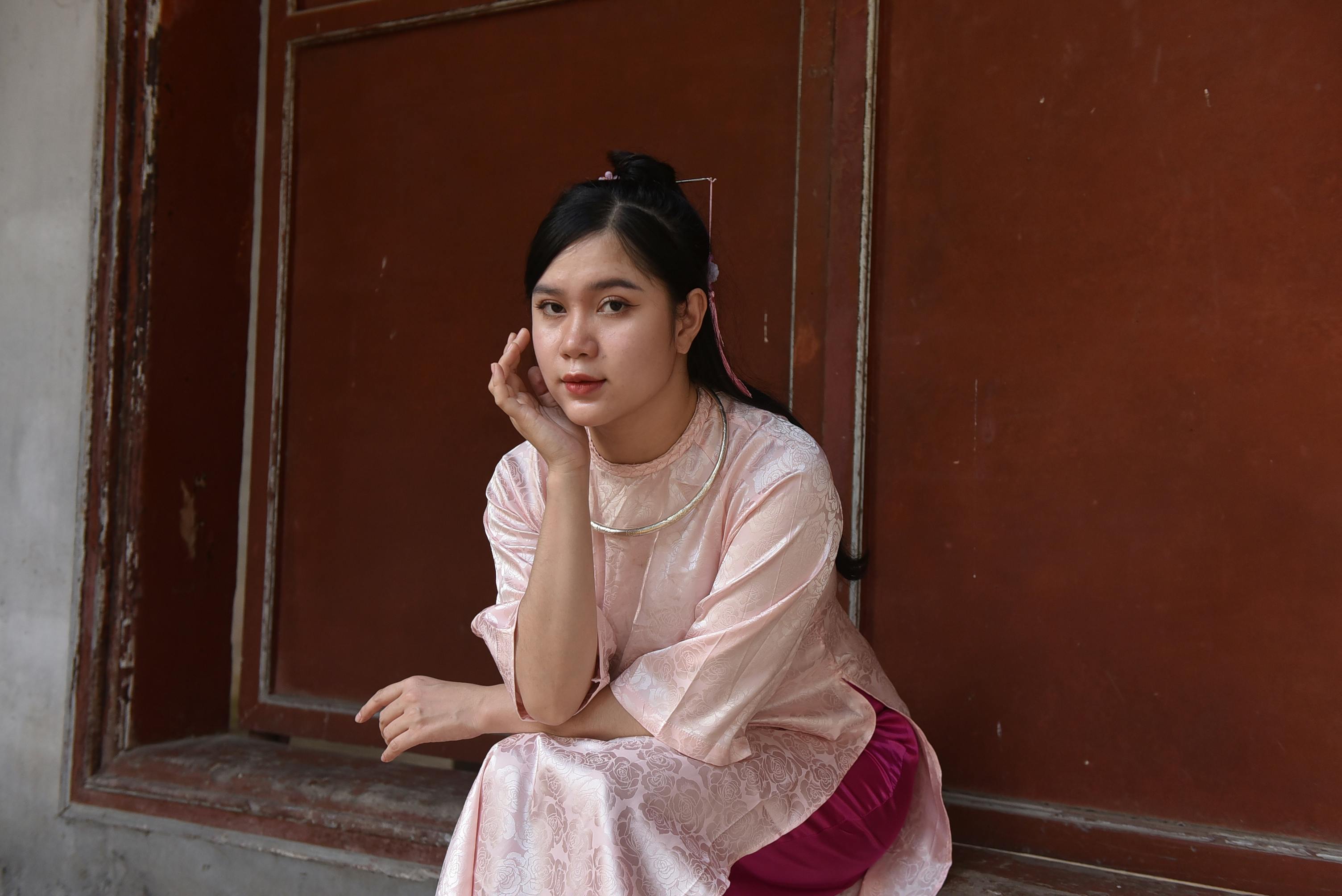 Portrait of an Asian Woman in Traditional Clothing Sitting on a ...