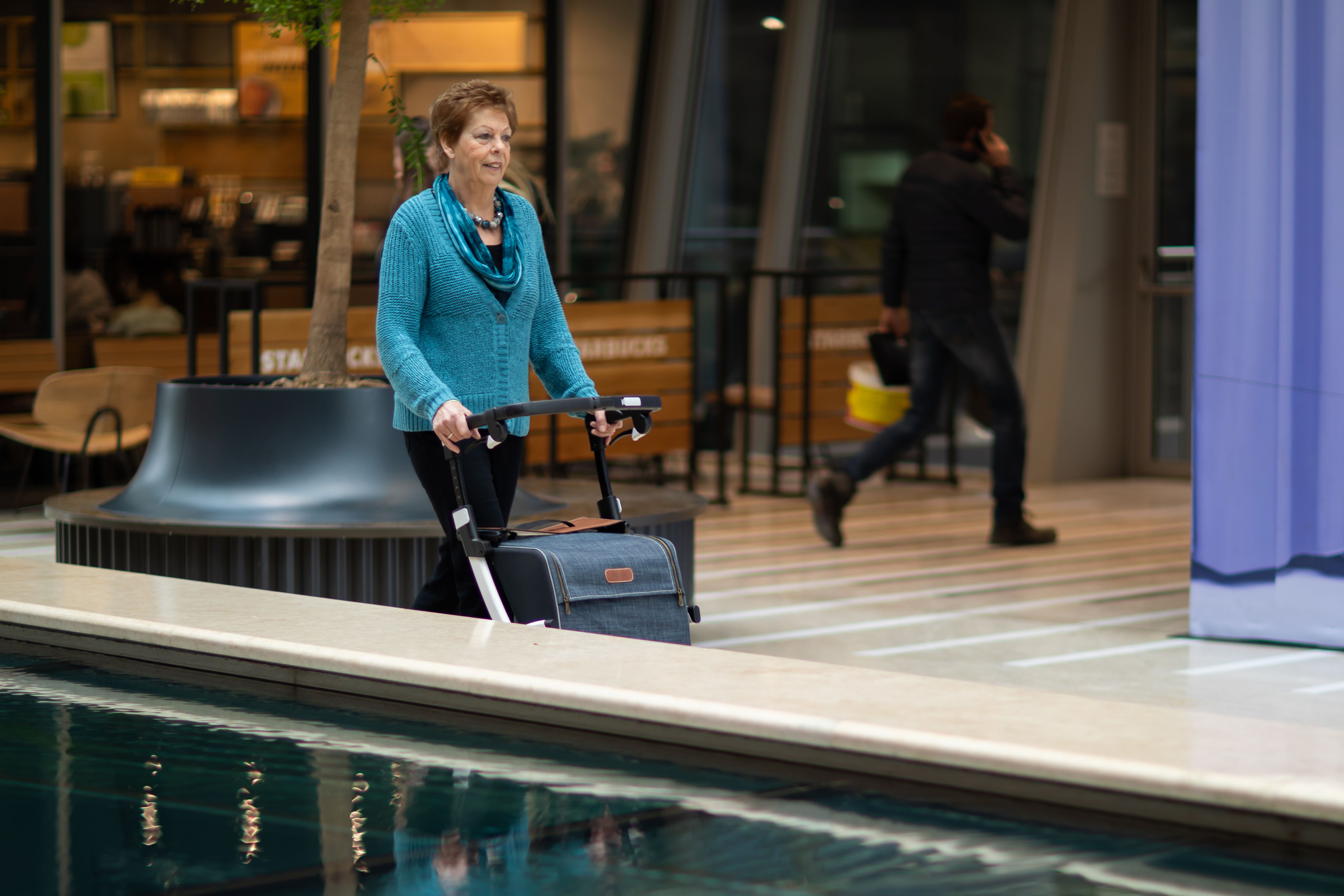 Woman walking in a mall · Free Stock Photo