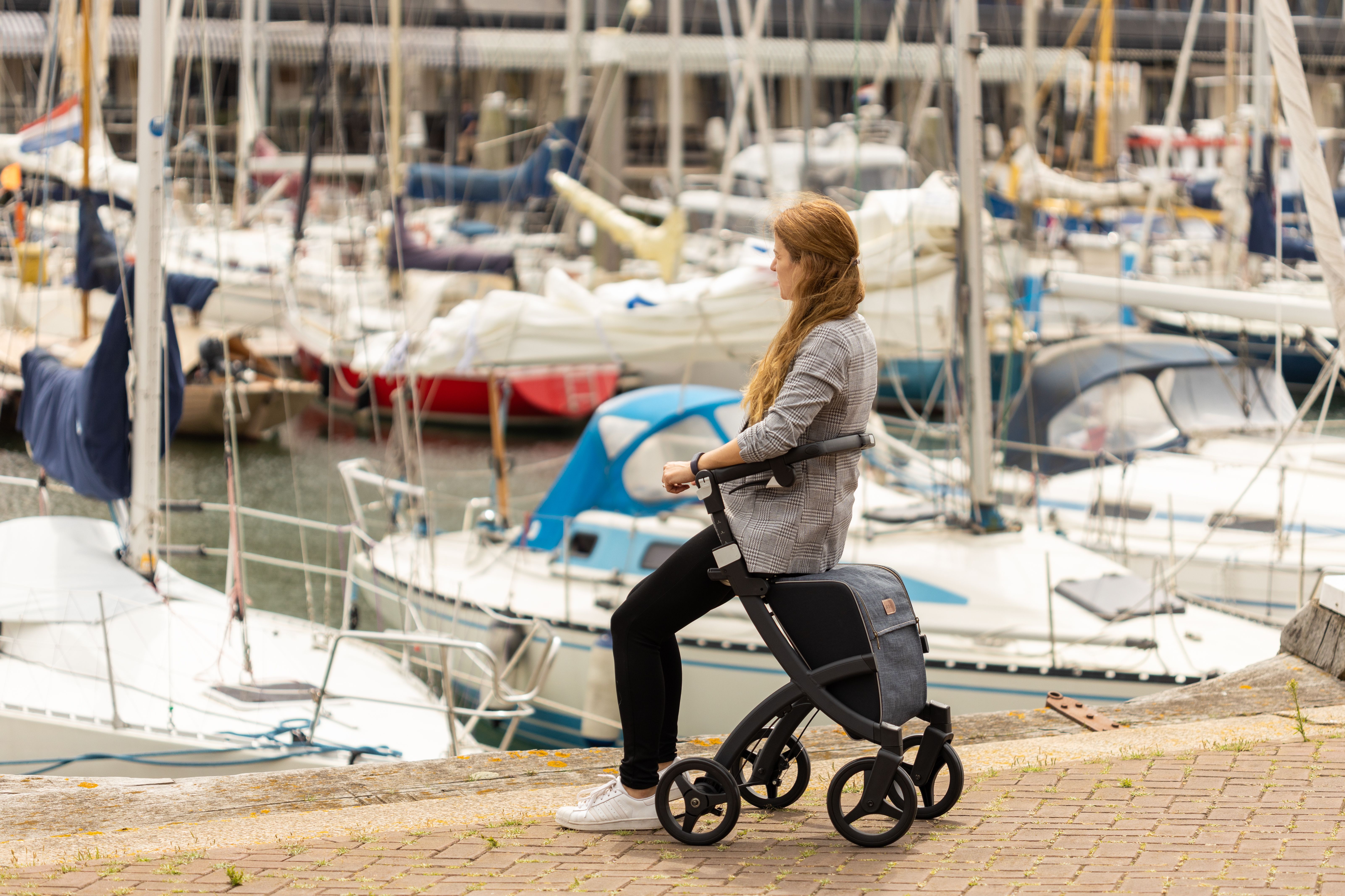 Woman sitting on a rollator walker · Free Stock Photo