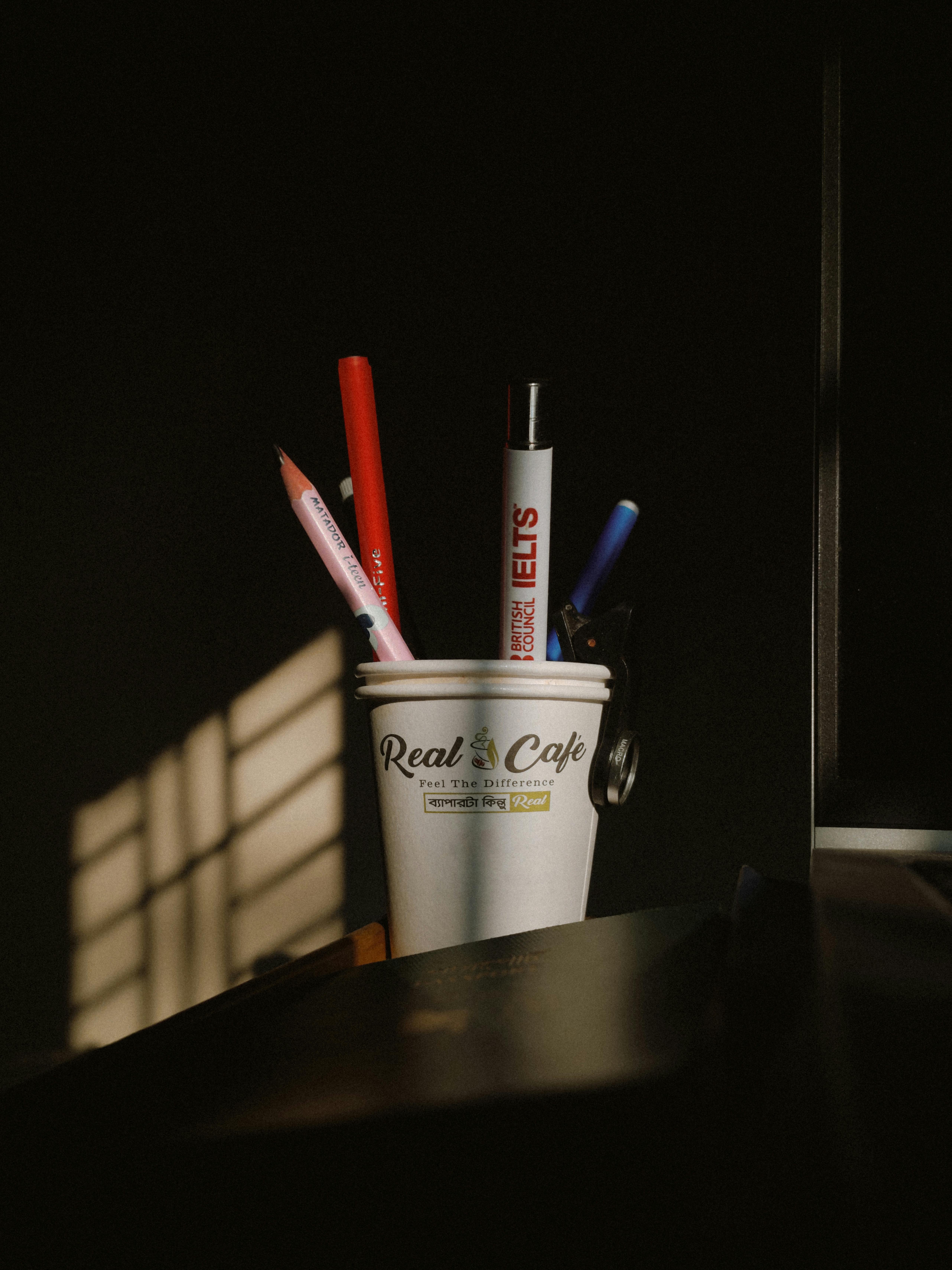 Close-up of a Cup with Pens and Pencils Standing in Sunlight · Free ...