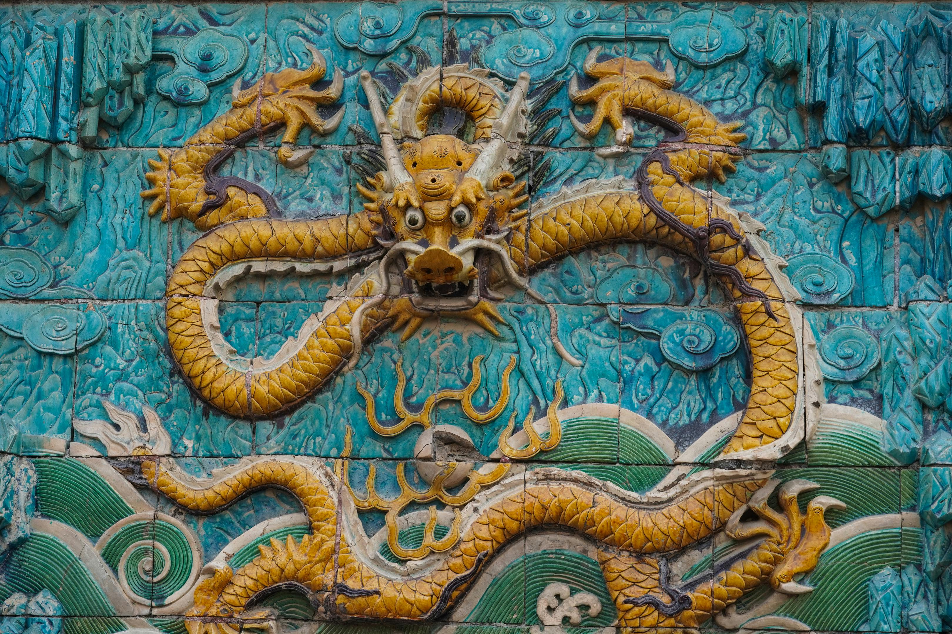 A dragon painted on the wall of a building · Free Stock Photo
