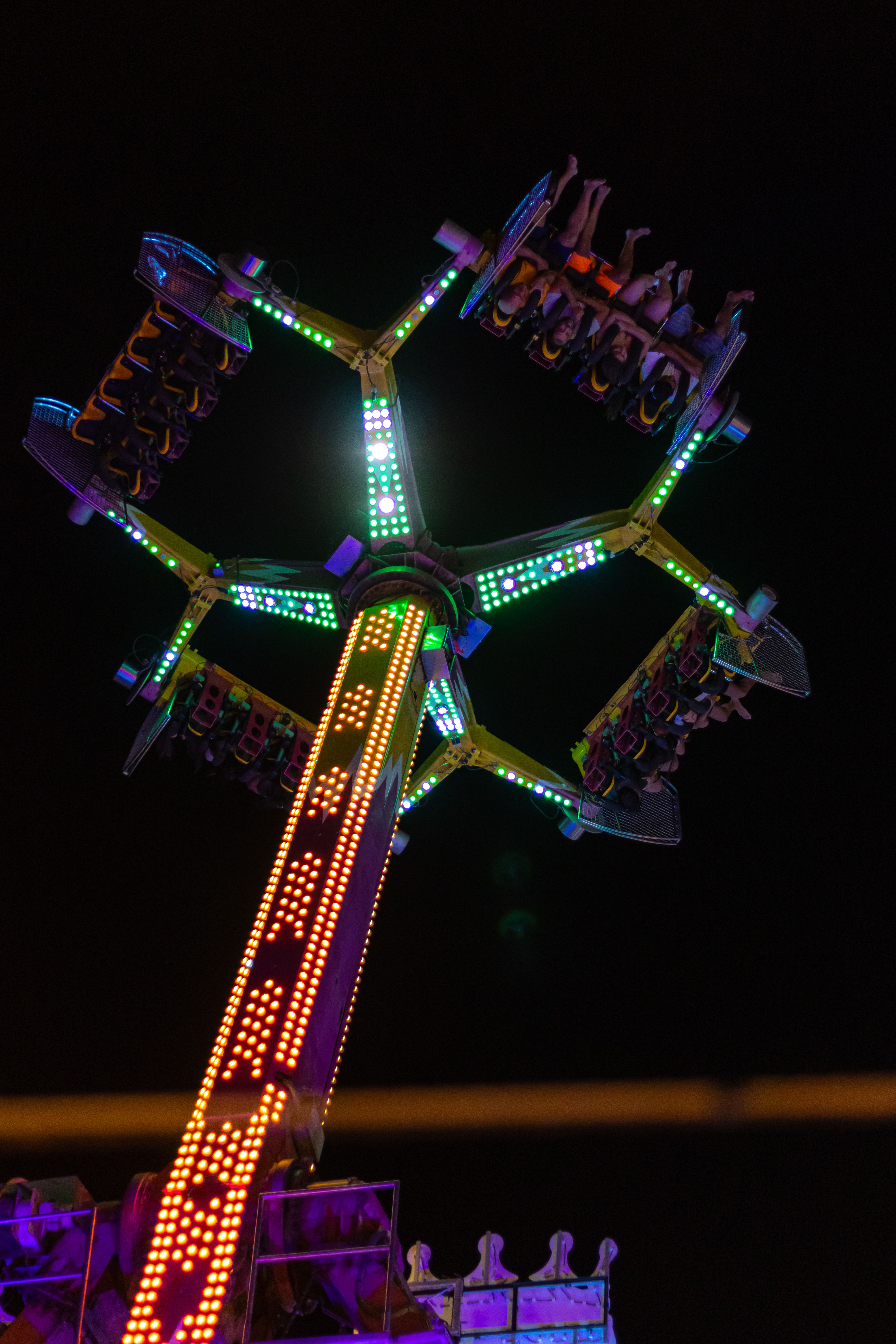 Illuminated Carousel in a Funfair at Night · Free Stock Photo