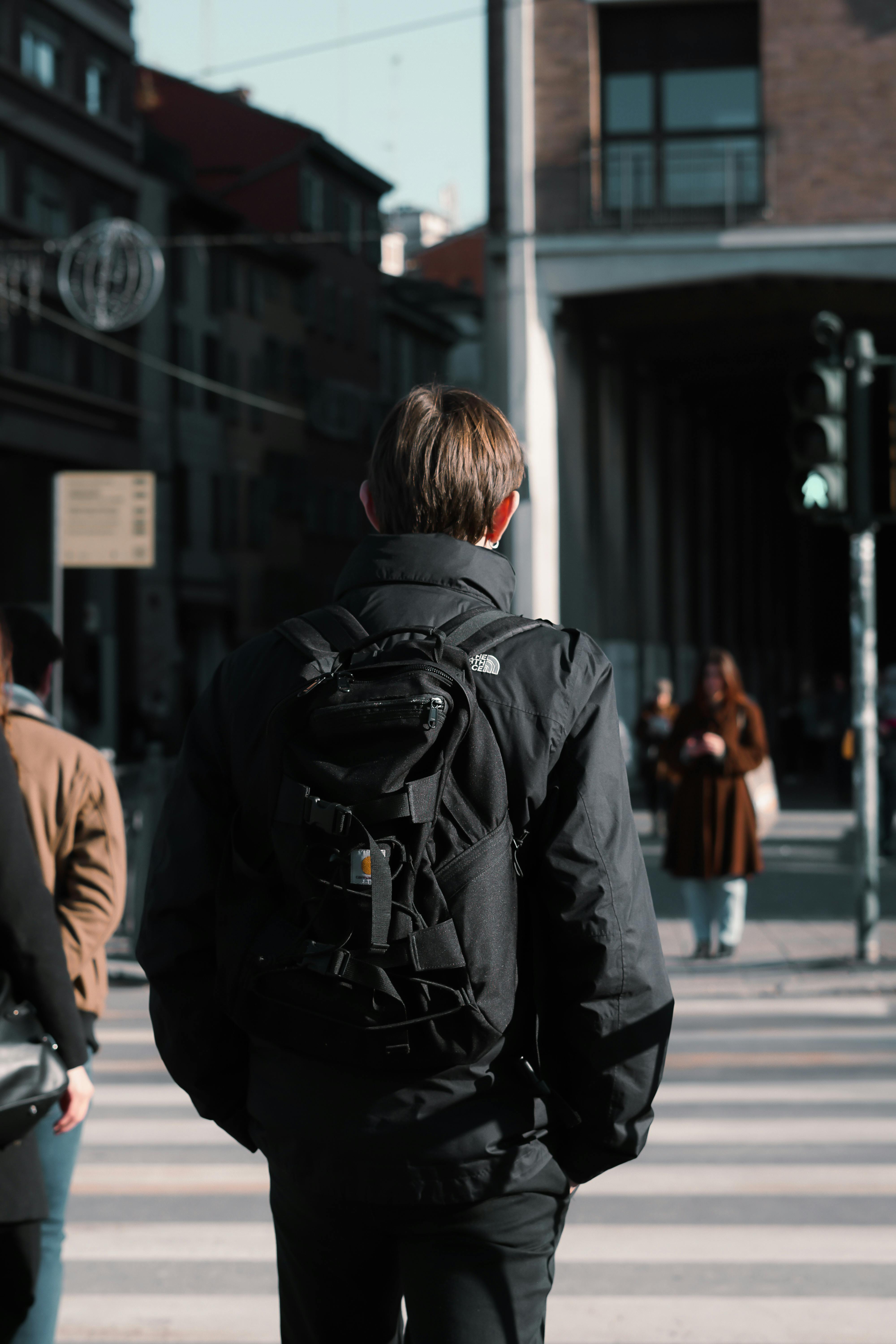 Back View of Man in Jacket and with Backpack Standing by Crosswalk ...