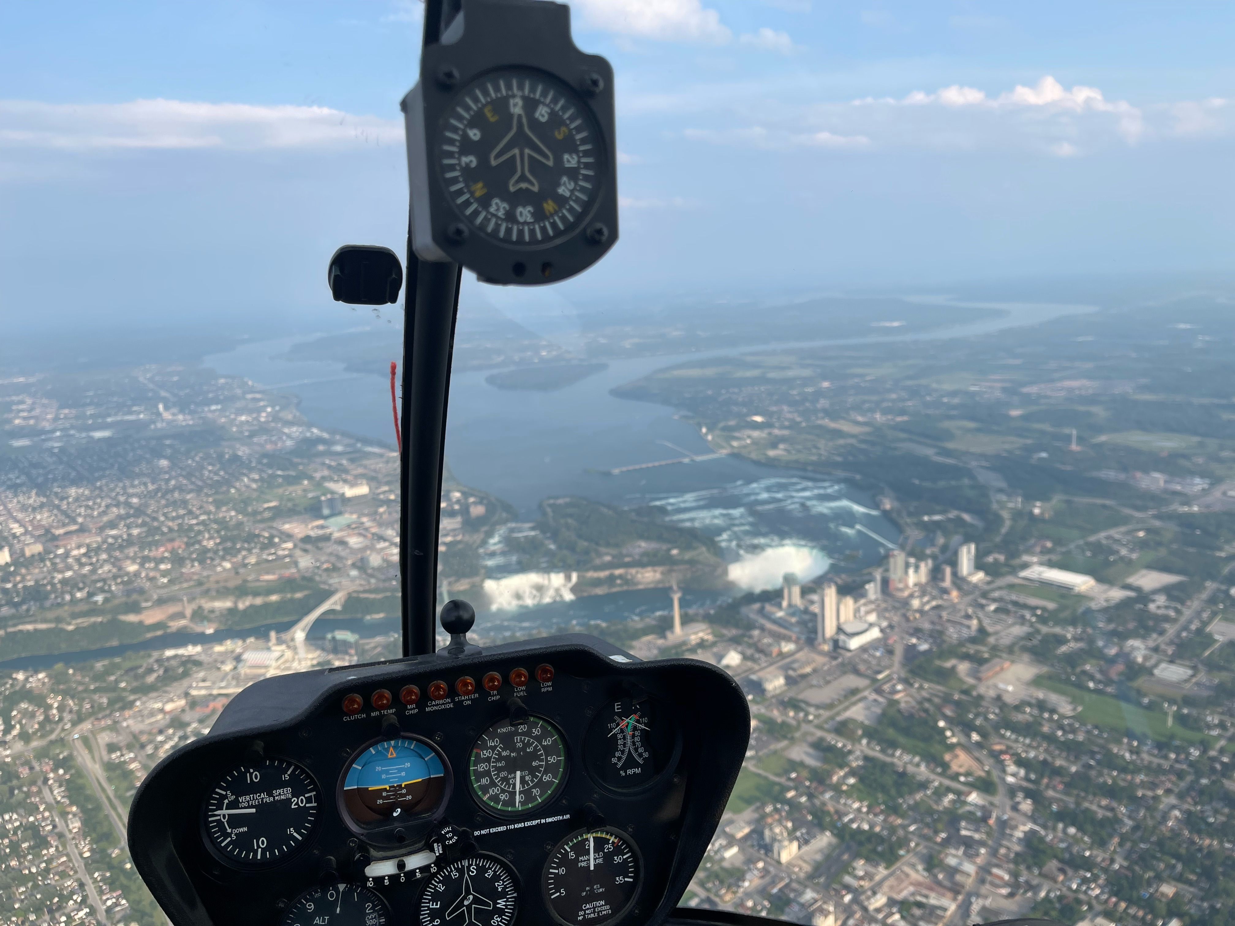 City behind Windows in Aircraft Cockpit · Free Stock Photo