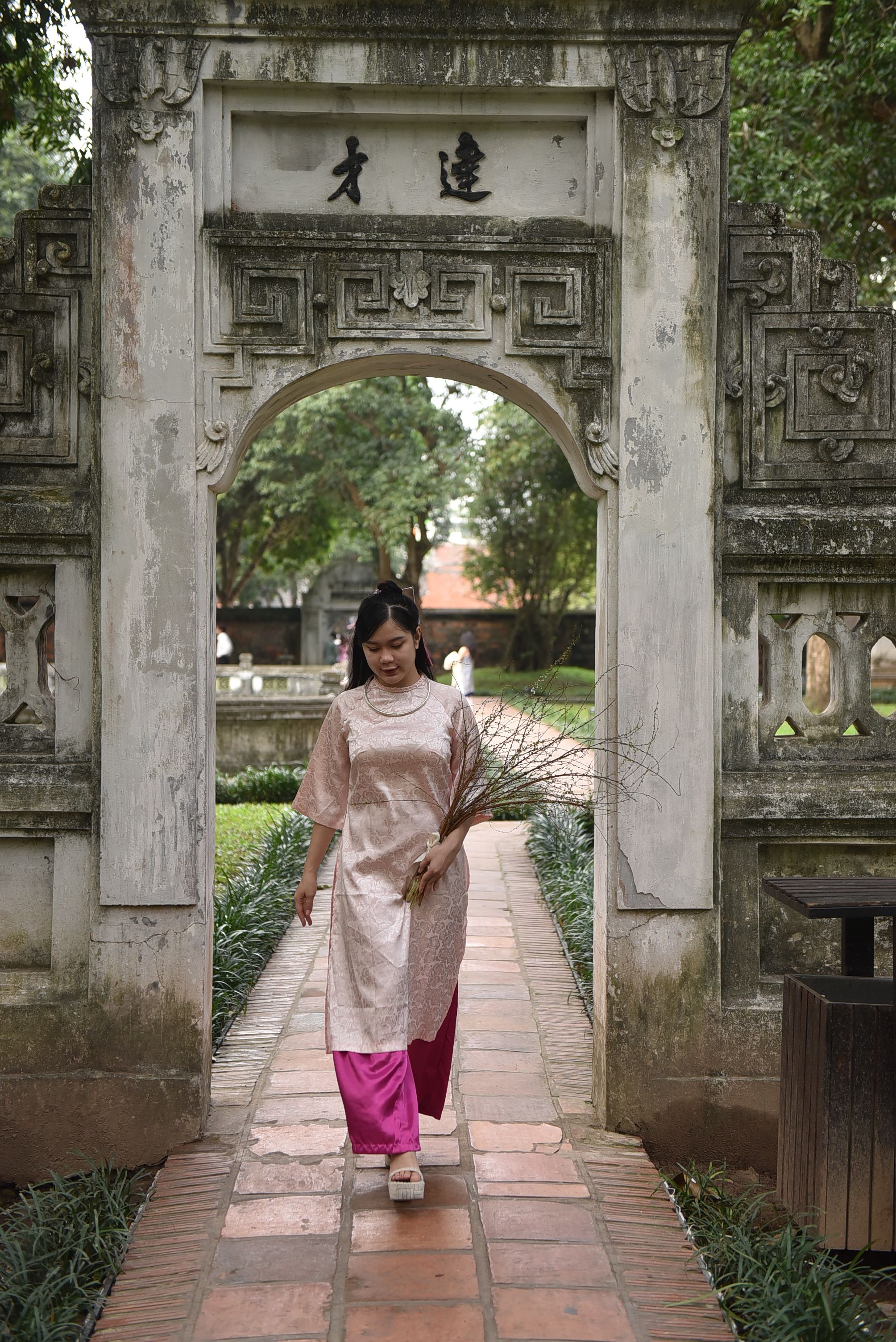 Woman Walking in Traditional Clothing · Free Stock Photo