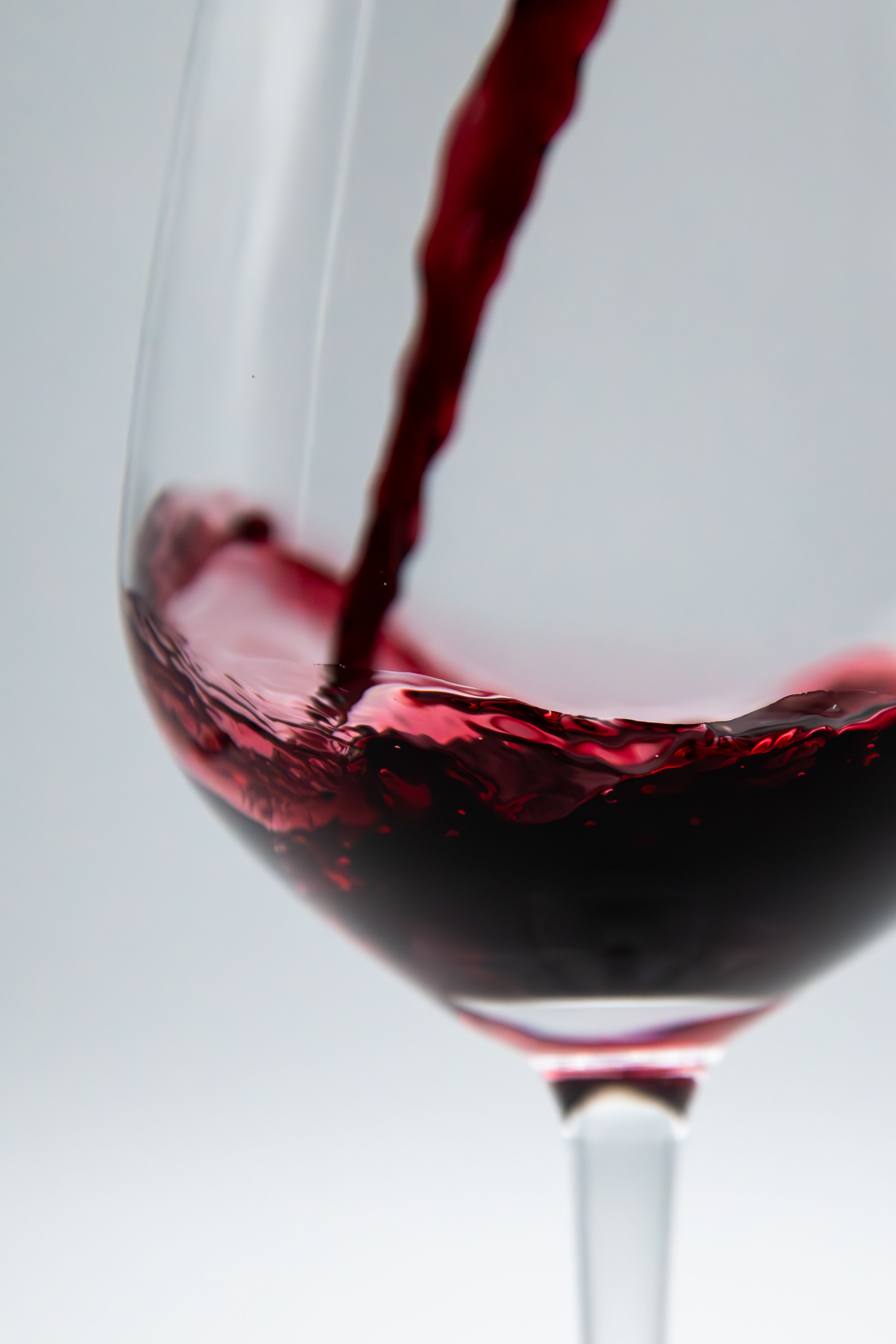 Person Pouring Wine on Wine Glass · Free Stock Photo