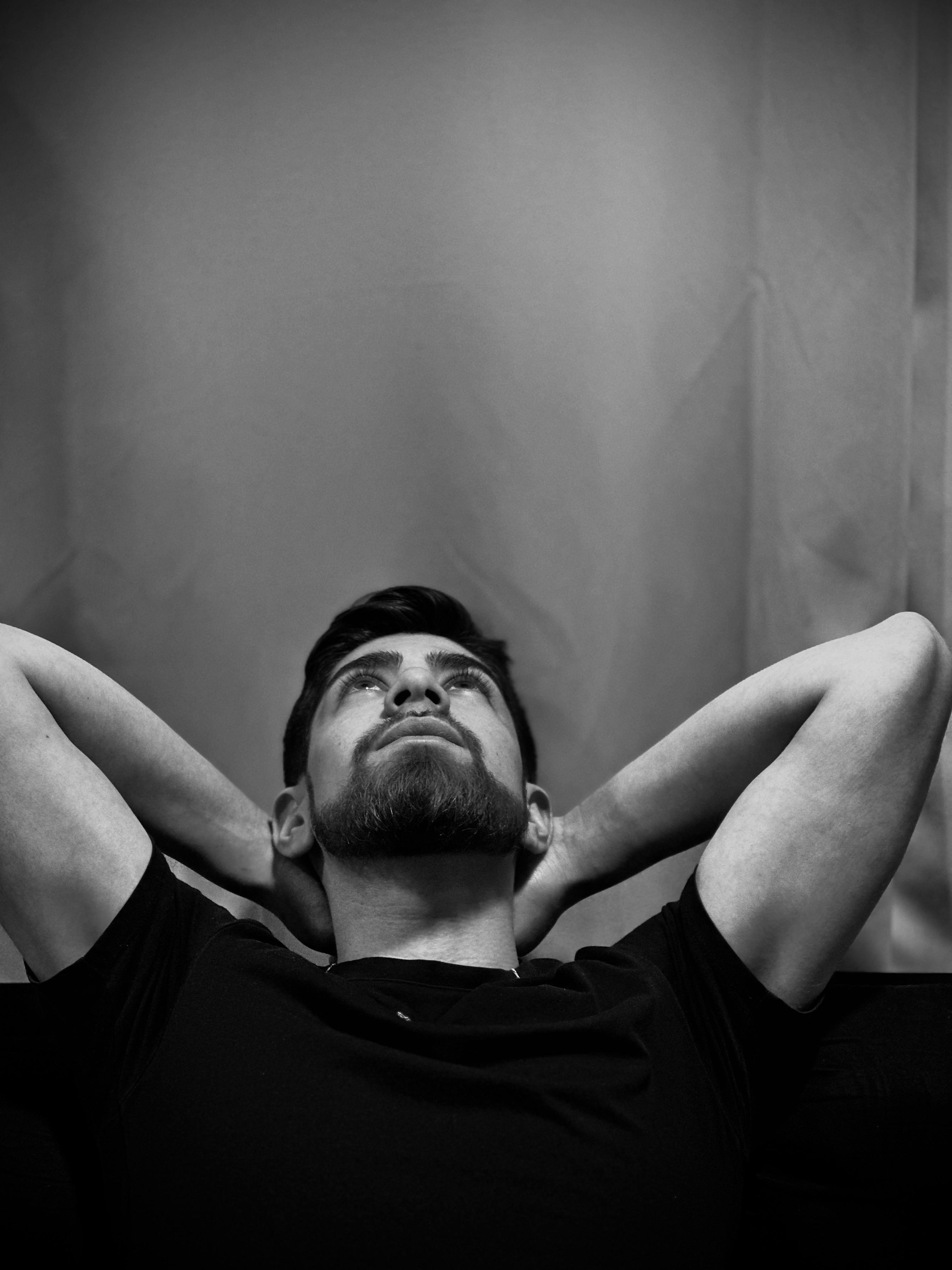 Young Man Staring at the Ceiling · Free Stock Photo