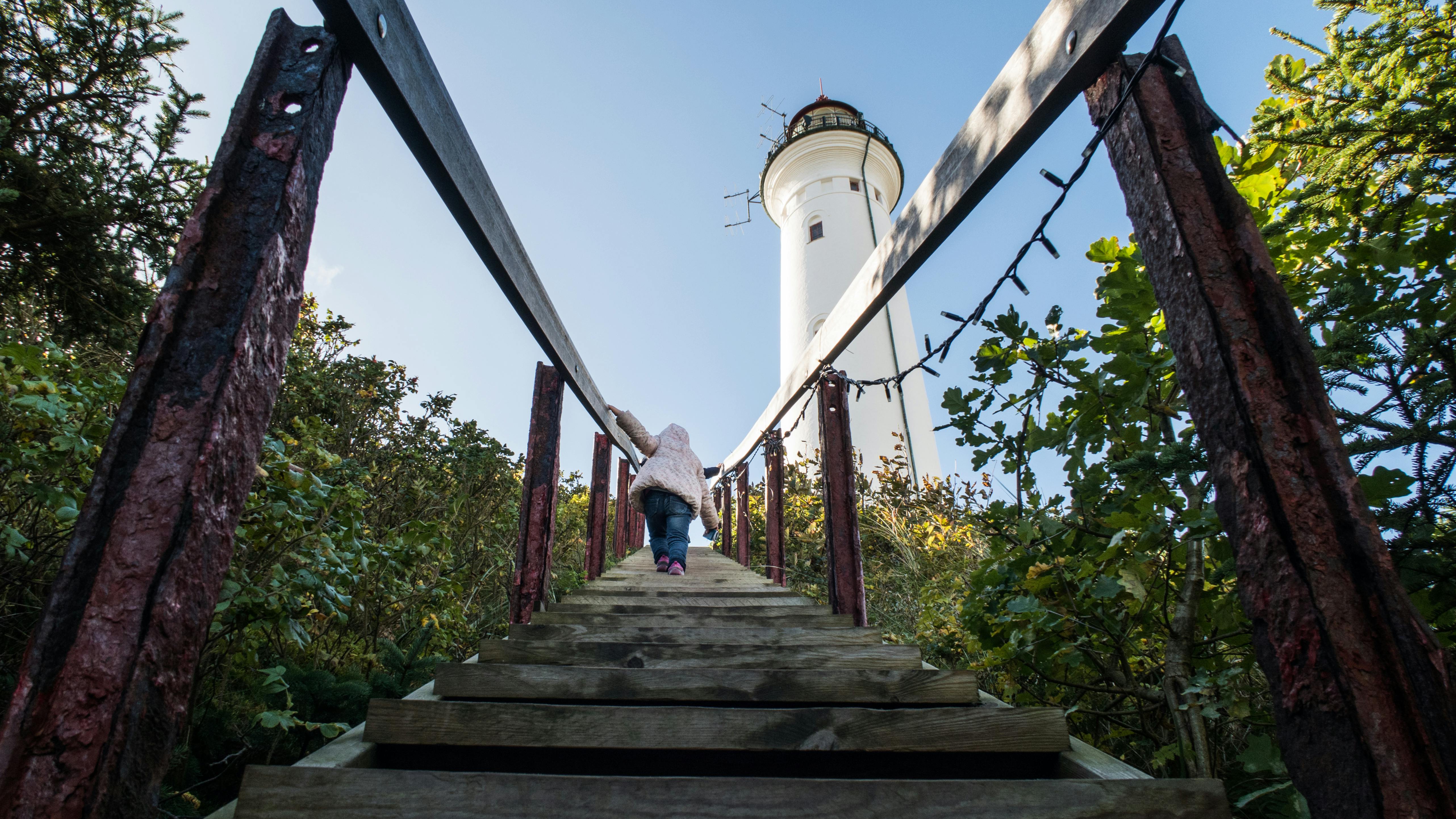 Young Tourist Climbing the Stairs Under Lyngvig Lighthouse Museum ...