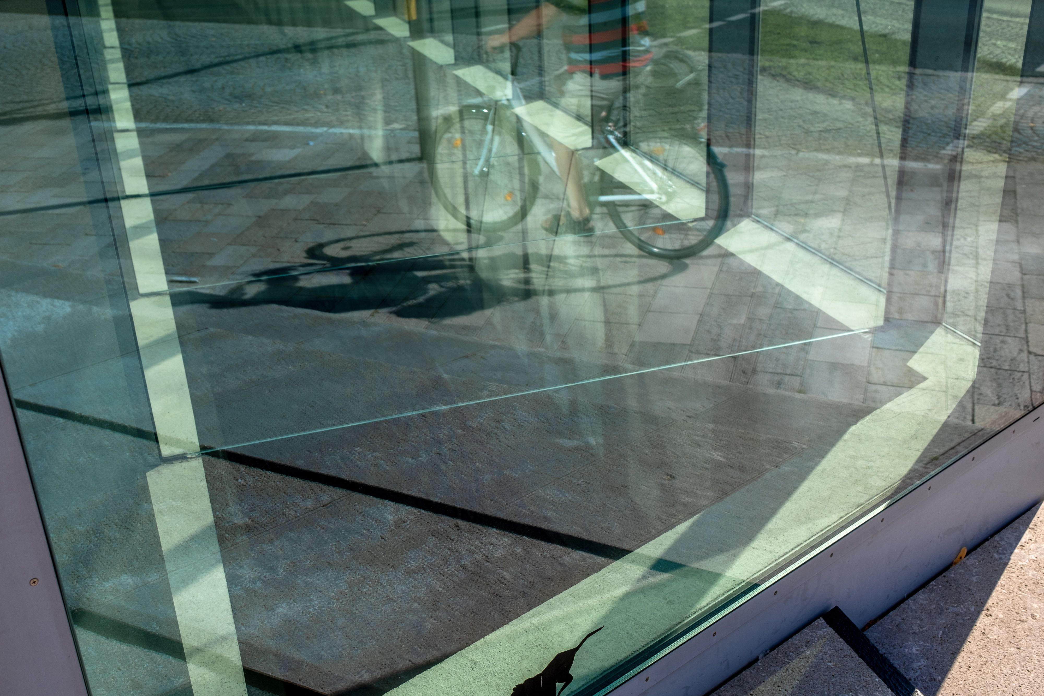 Reflection of a Cyclist in the Window · Free Stock Photo