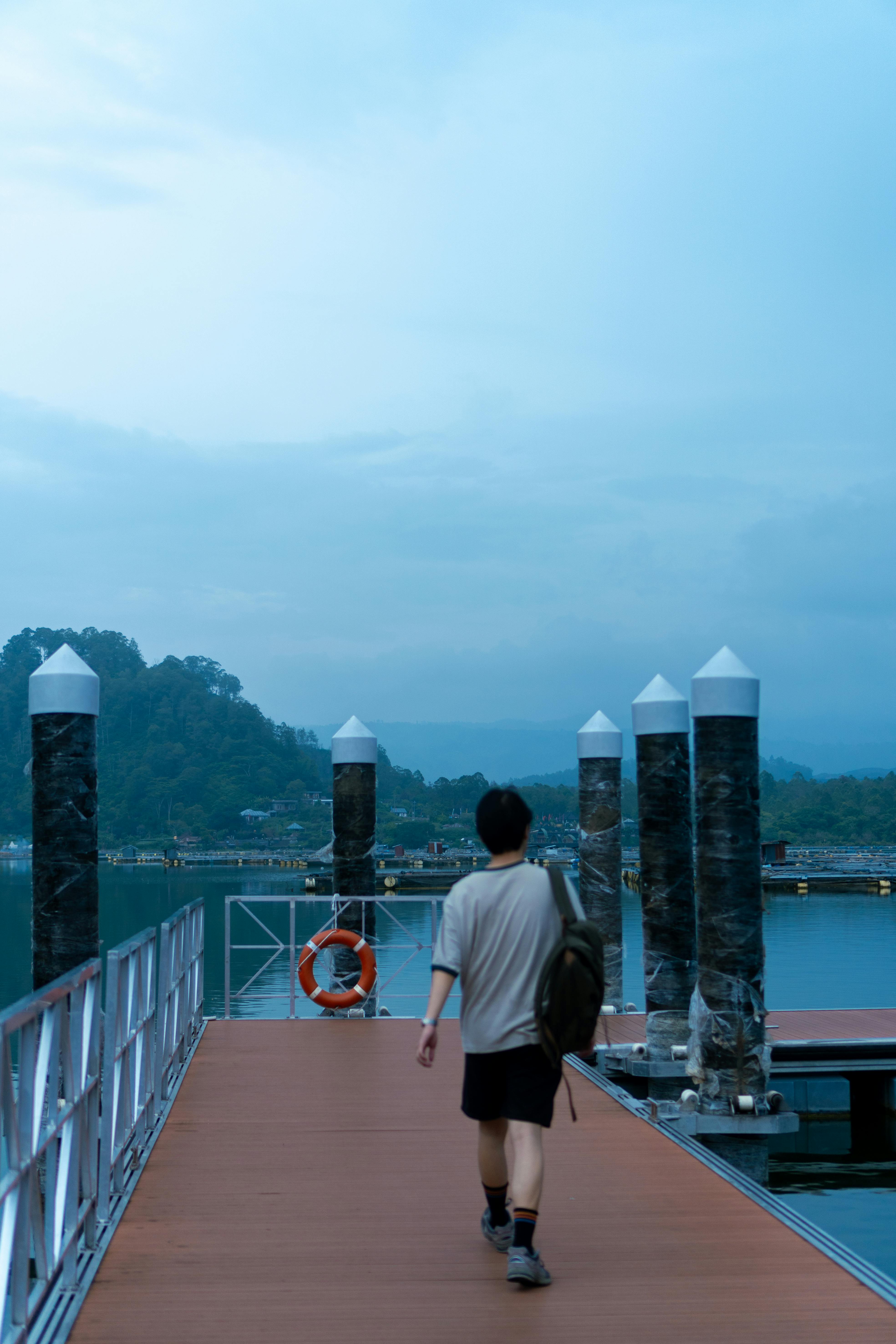 Young Man on Jetty · Free Stock Photo