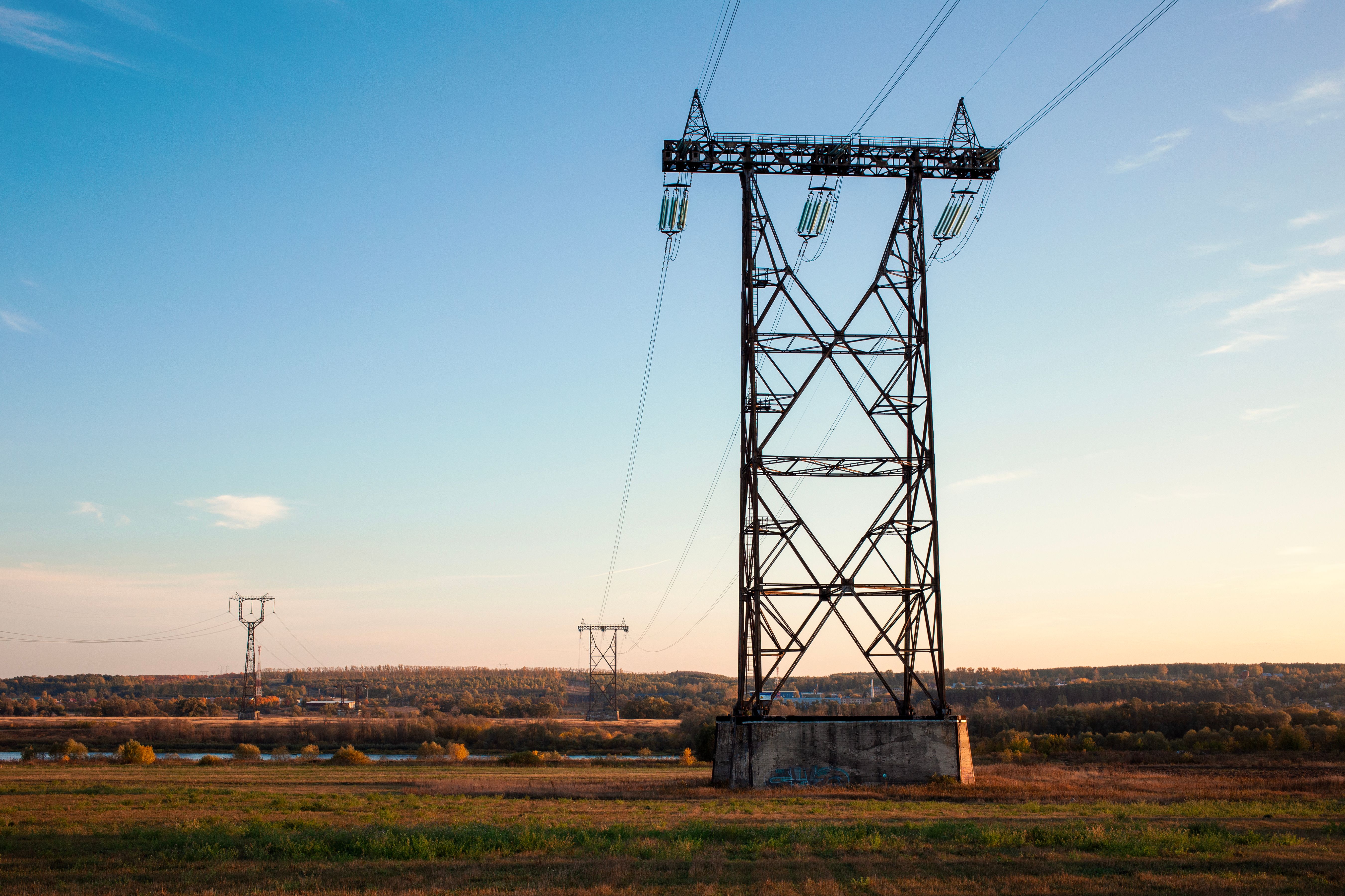 Power Transmission Towers in Landscape · Free Stock Photo