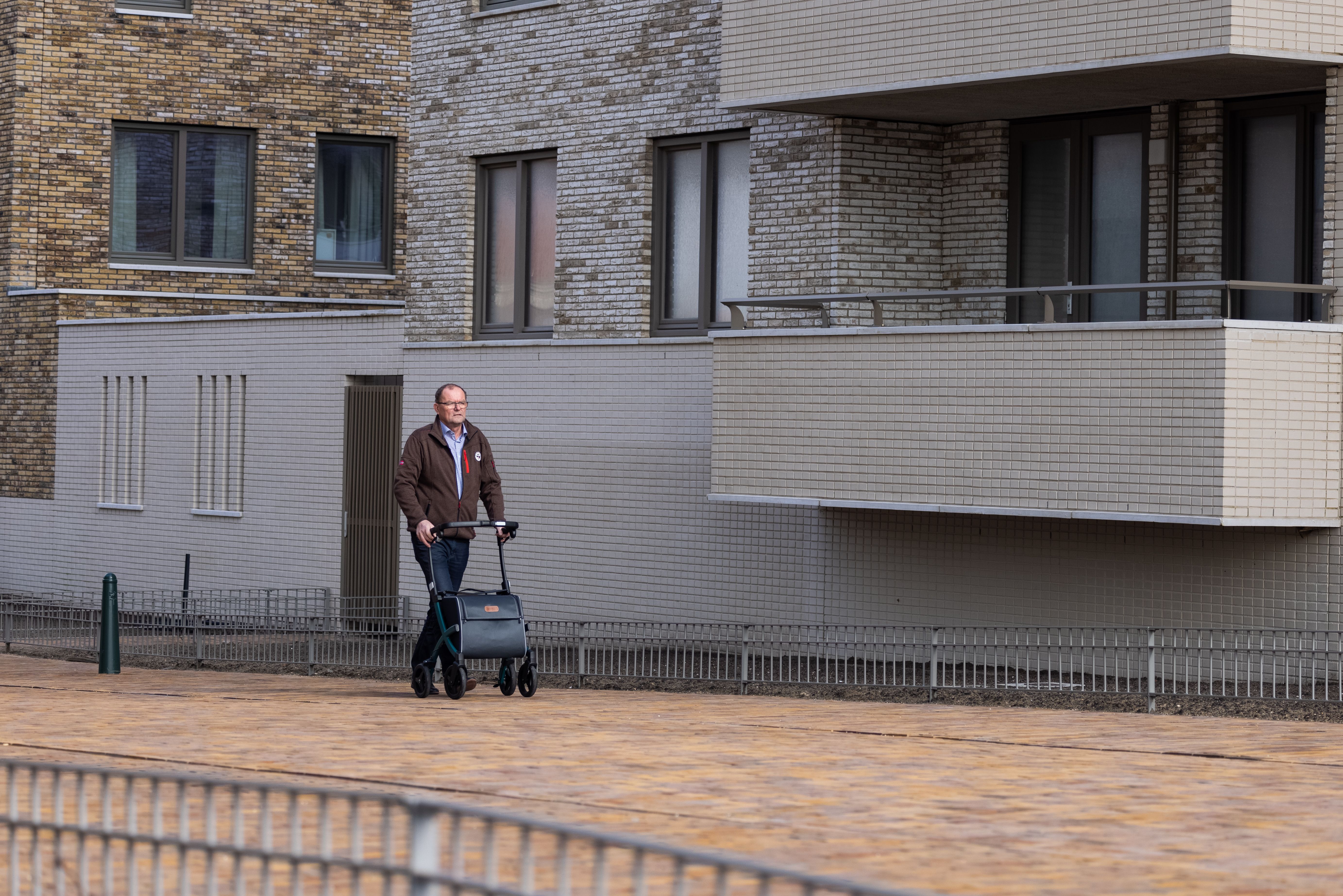 Old man walking with a rollator · Free Stock Photo