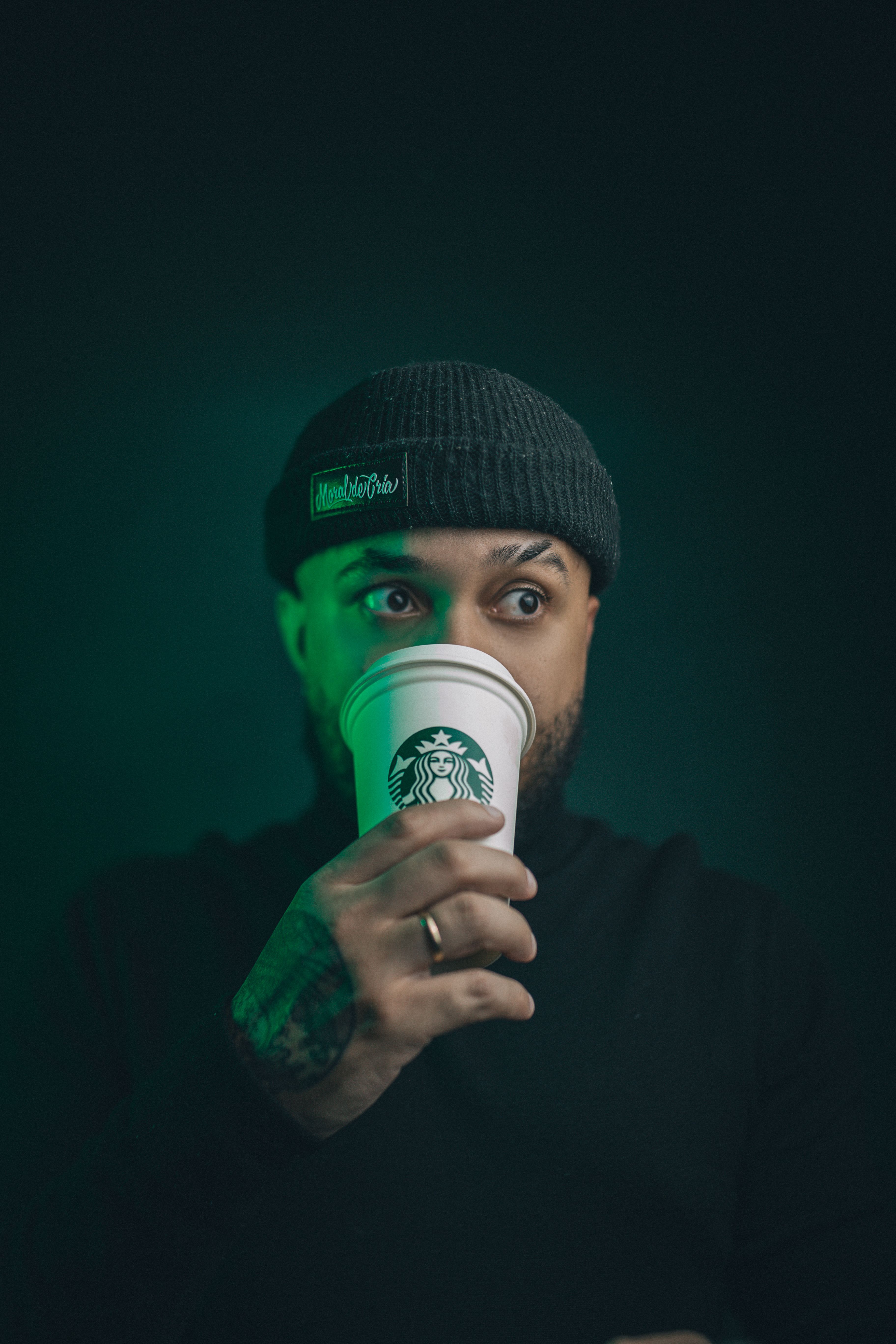 Portrait of Man in Hat and Drinking Coffee from Starbucks · Free Stock ...