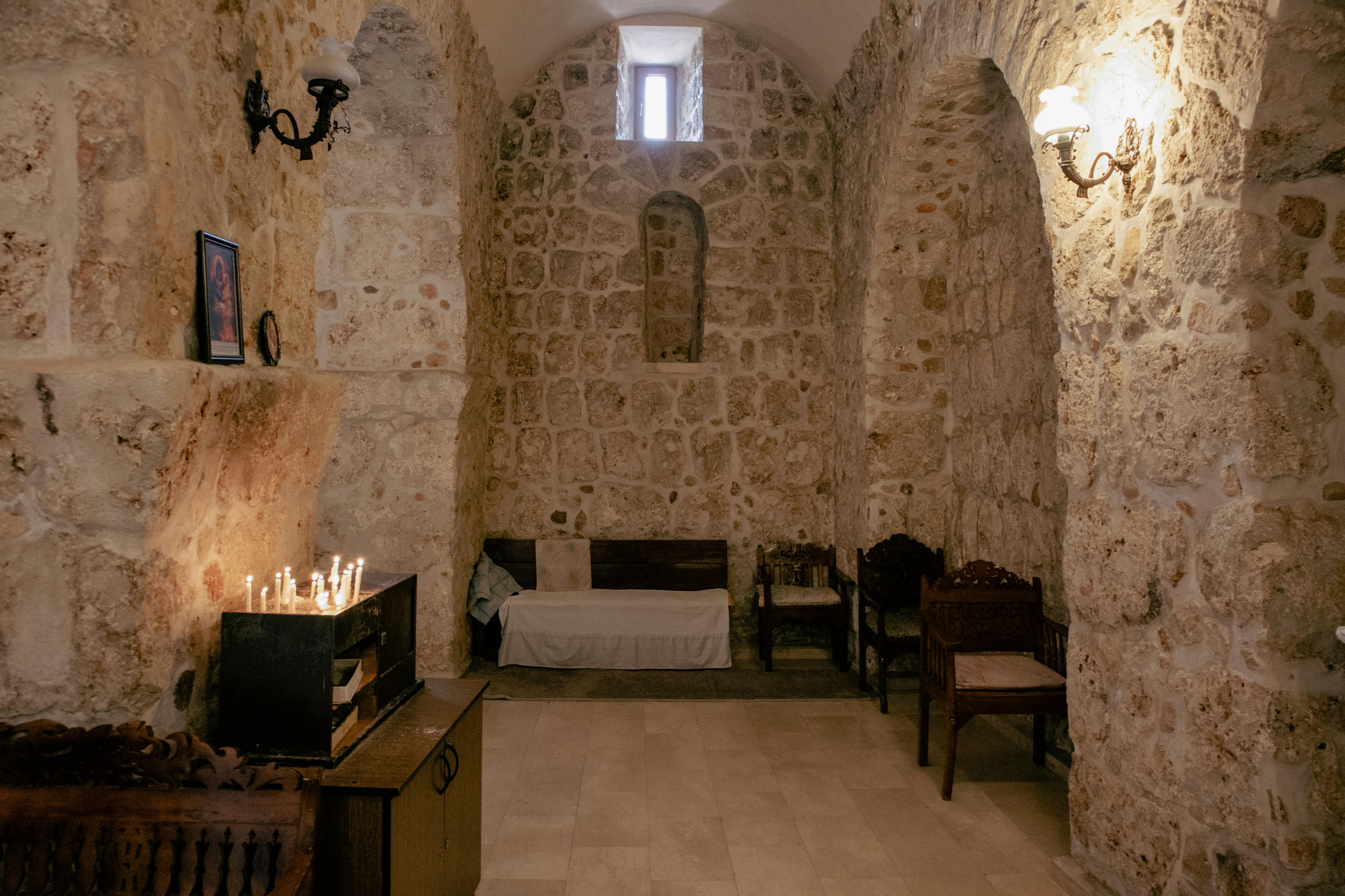 Ascetic Monastery Room with Arched Stone Walls · Free Stock Photo