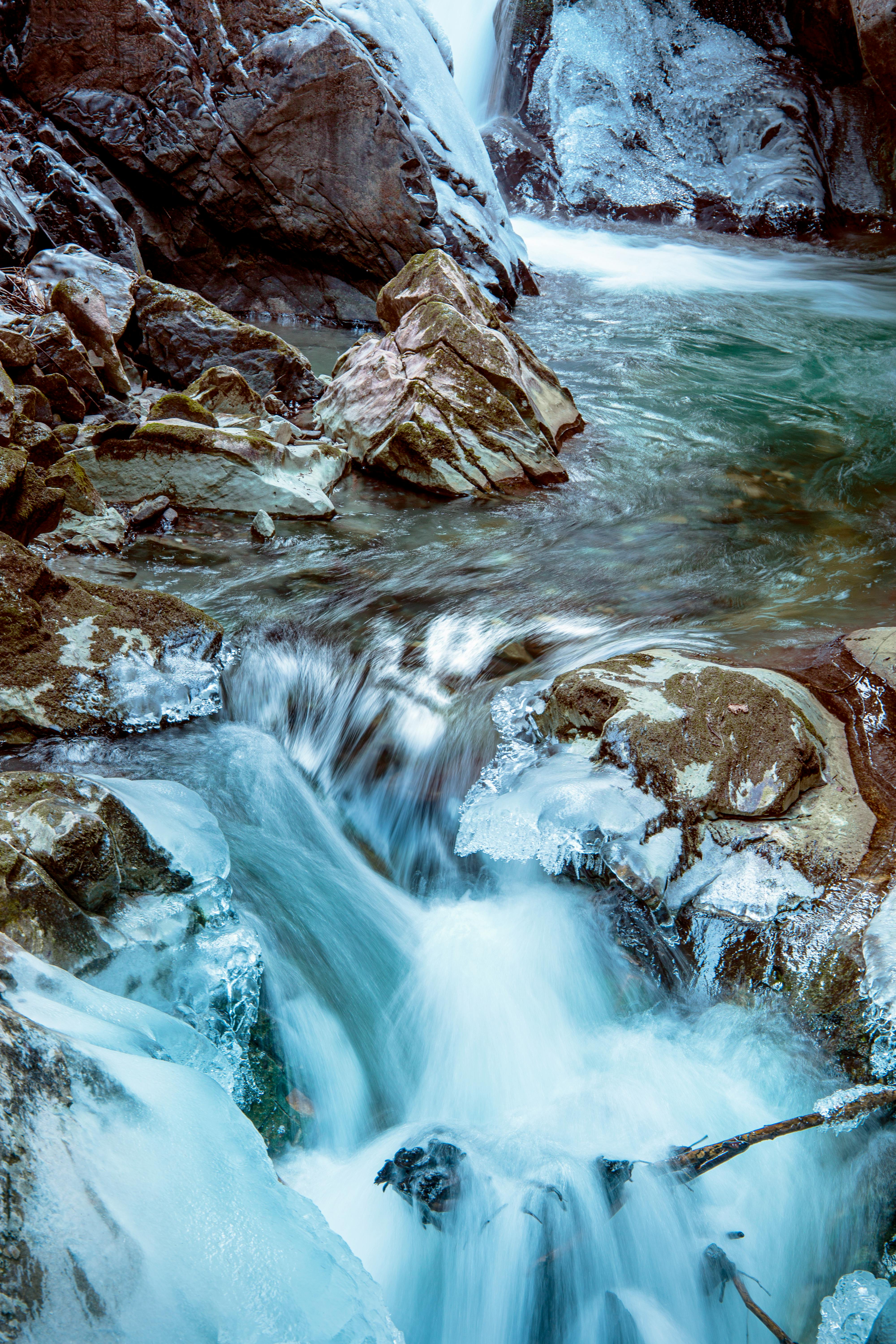 Rocks around Waterfall on Stream · Free Stock Photo